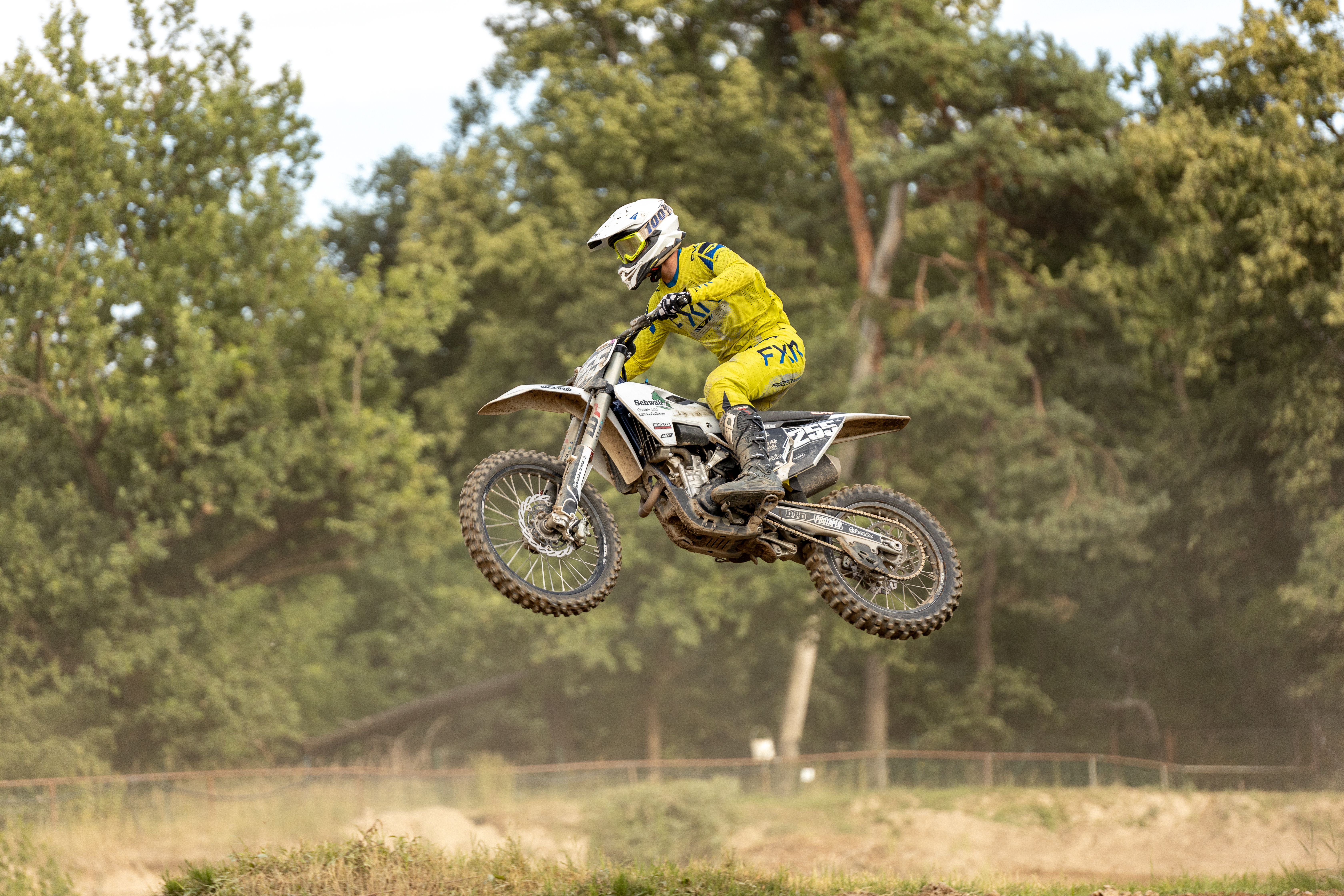 Dynamic Motocross Jump in Outdoor Terrain · Free Stock Photo