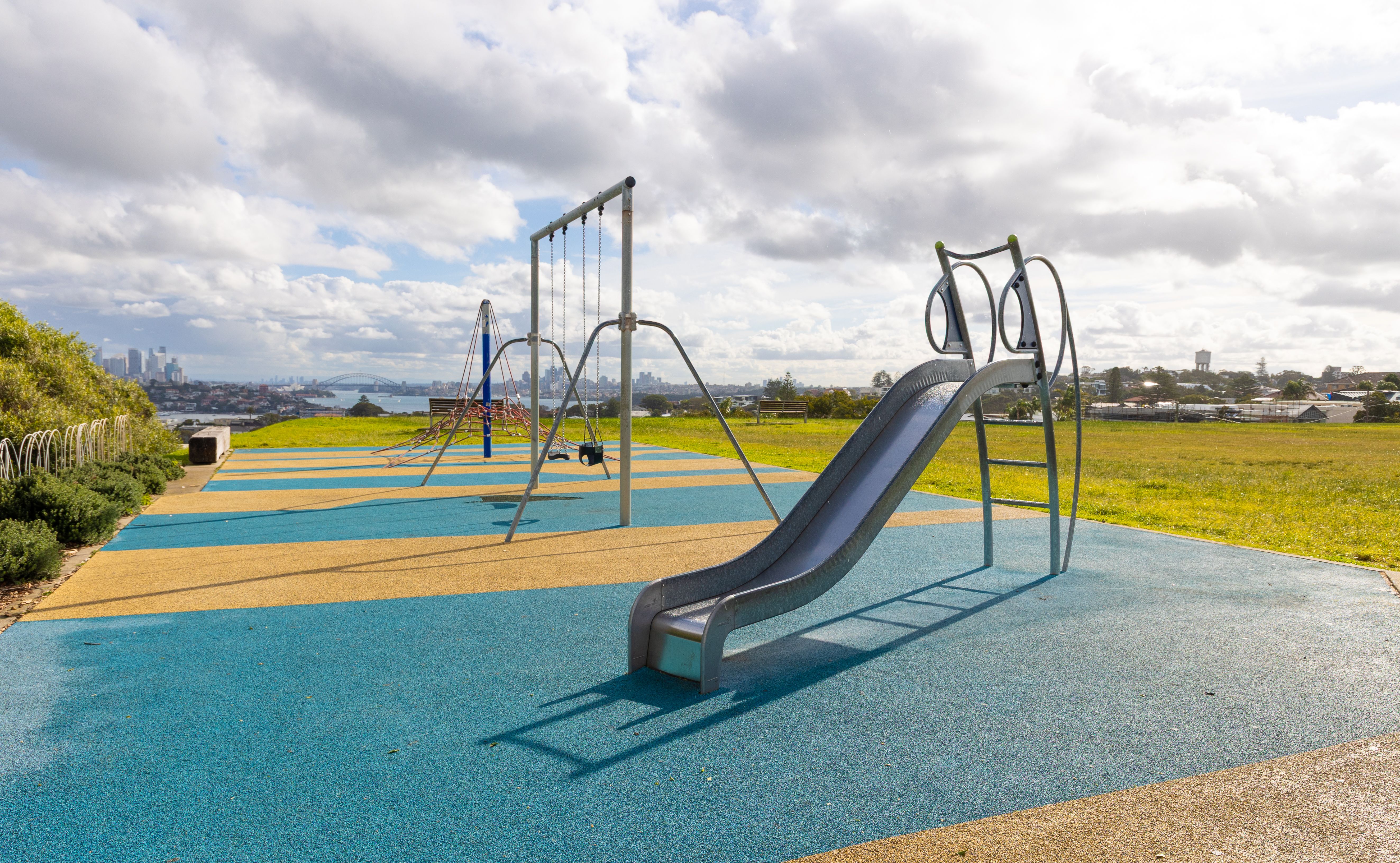 Sunny Playground with Slide and Swings · Free Stock Photo