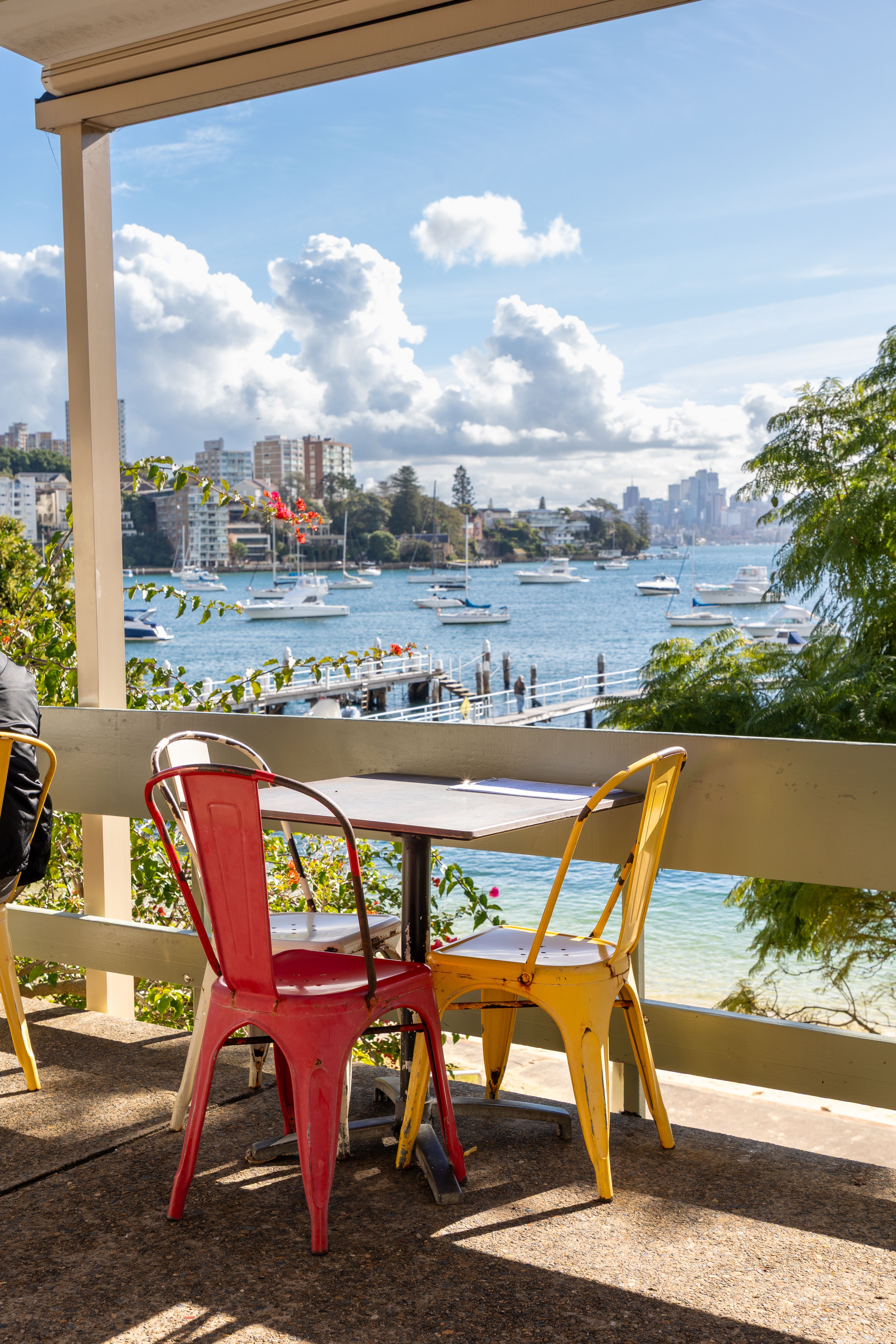 Vibrant outdoor cafe view overlooking harbor · Free Stock Photo