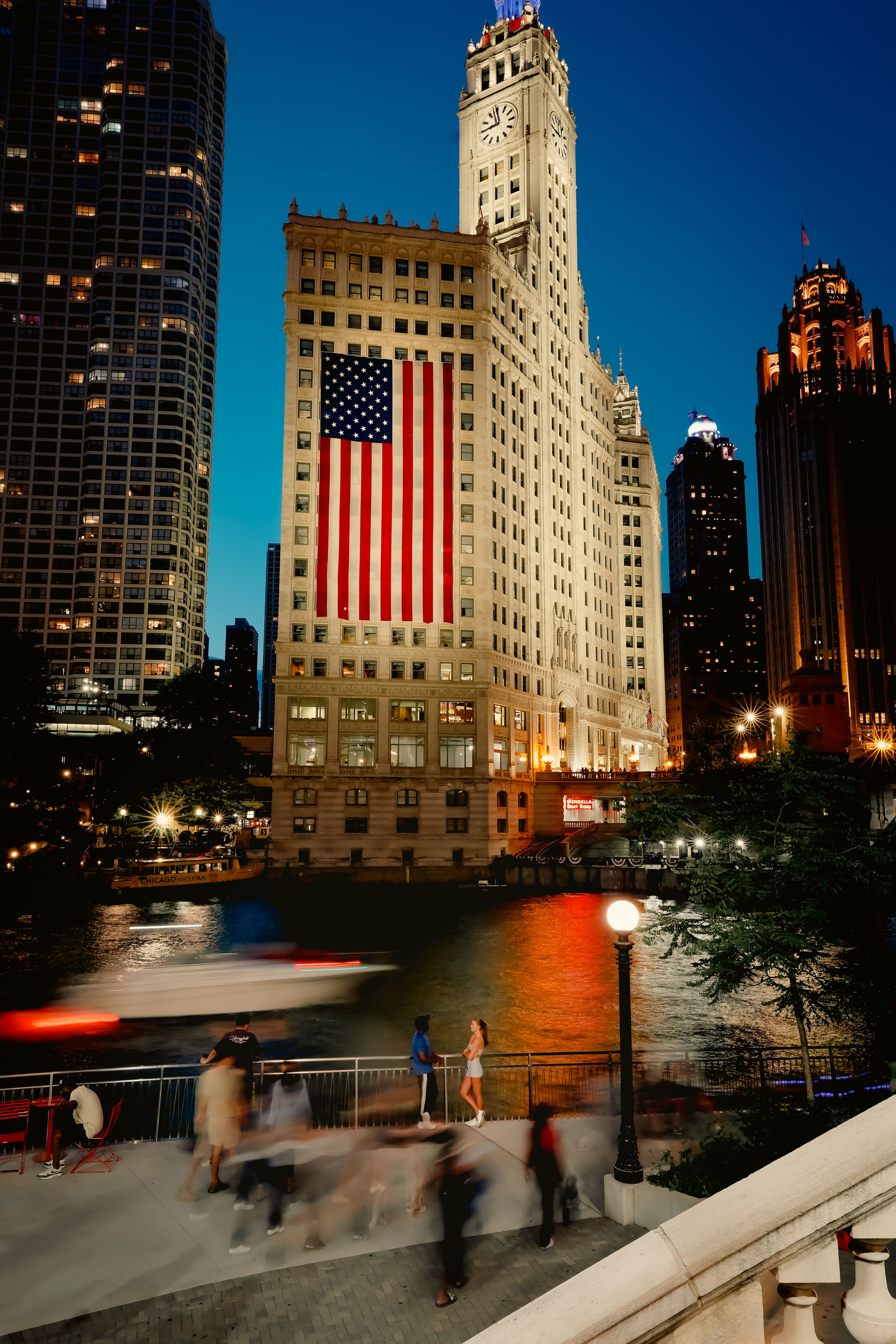 American Flag on Chicago's Wrigley Building at Dusk · Free Stock Photo