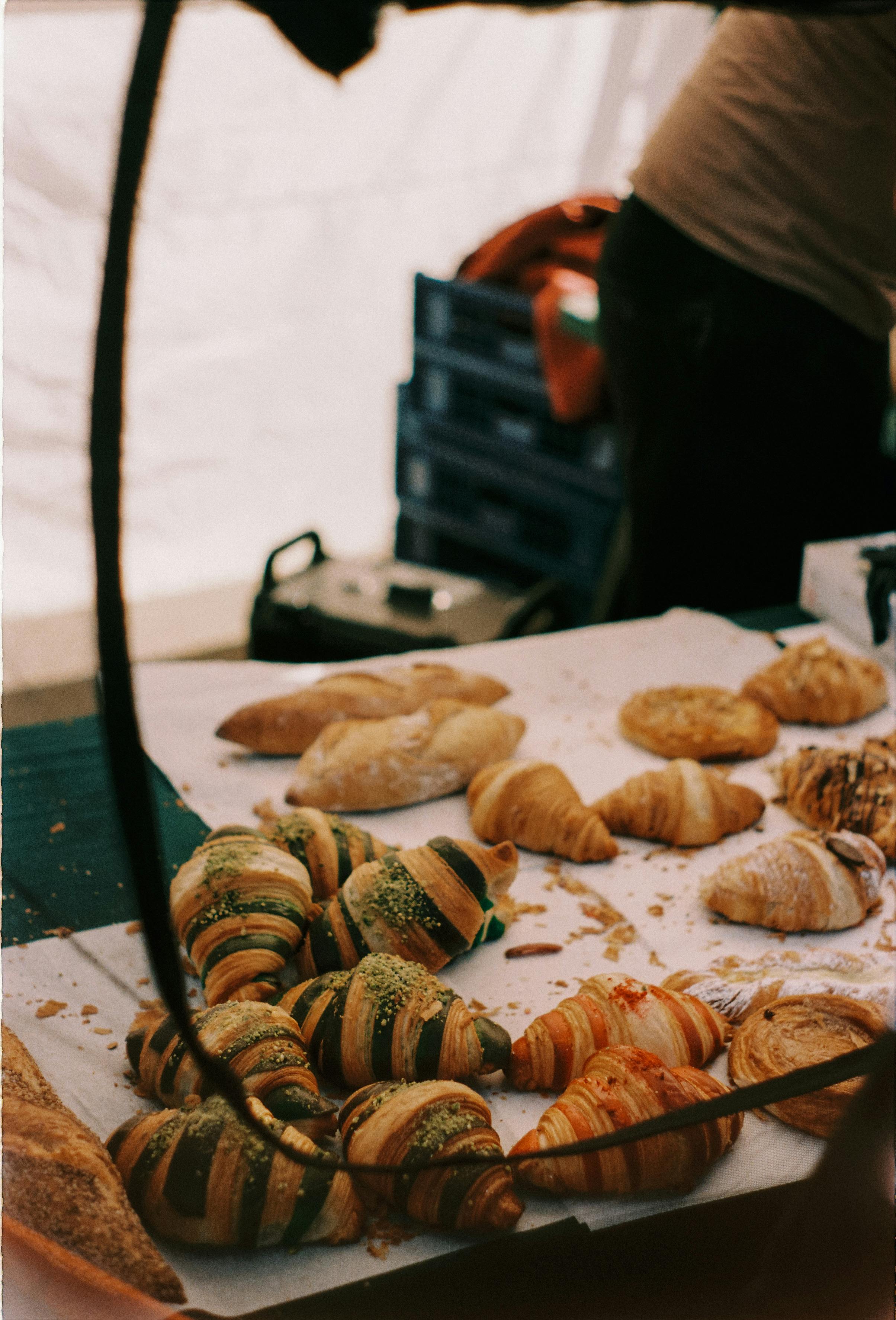 Assorted Croissants on Display at Bakery Stall · Free Stock Photo