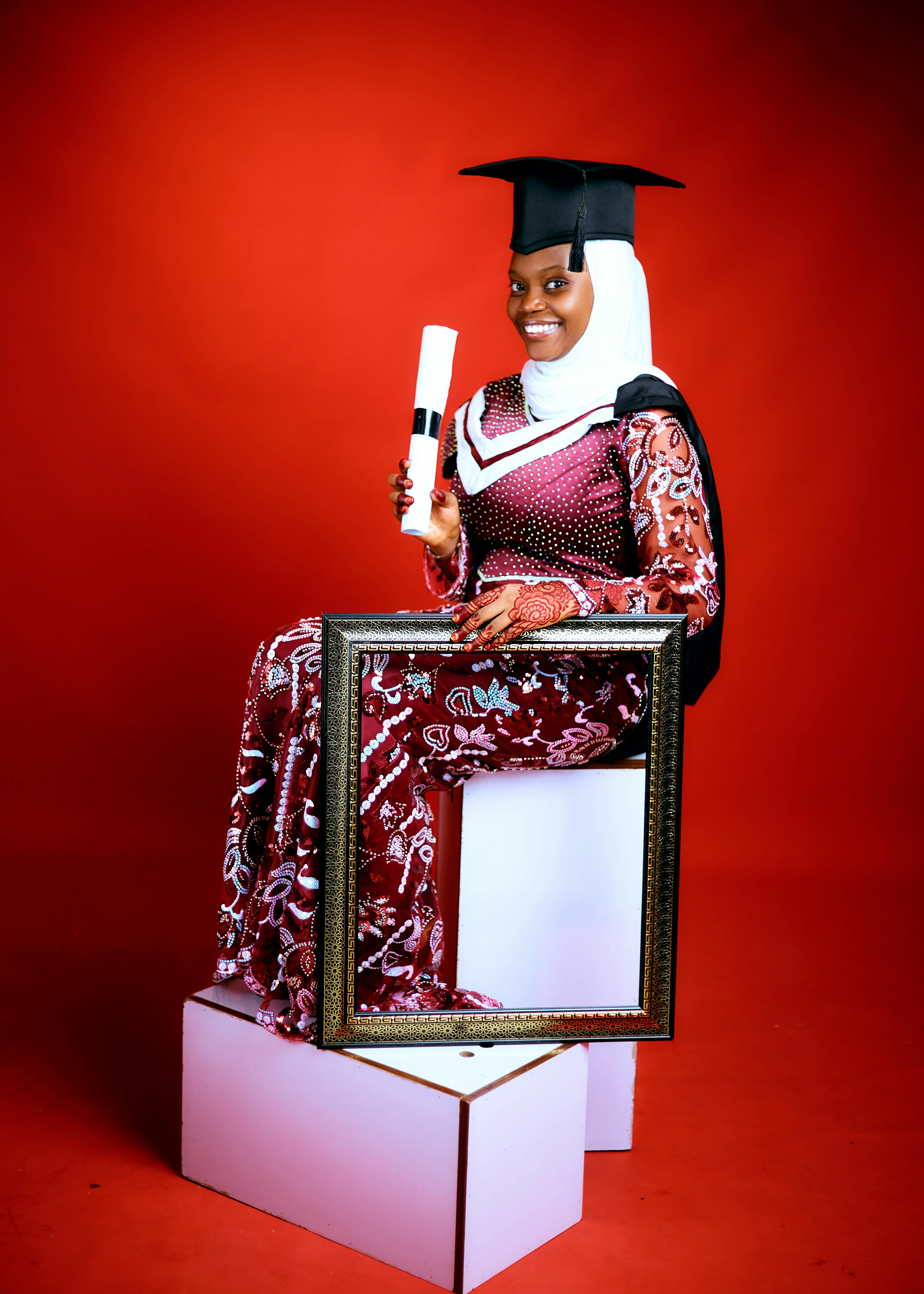 Muslim Graduate with Diploma Celebrating Achievement · Free Stock Photo