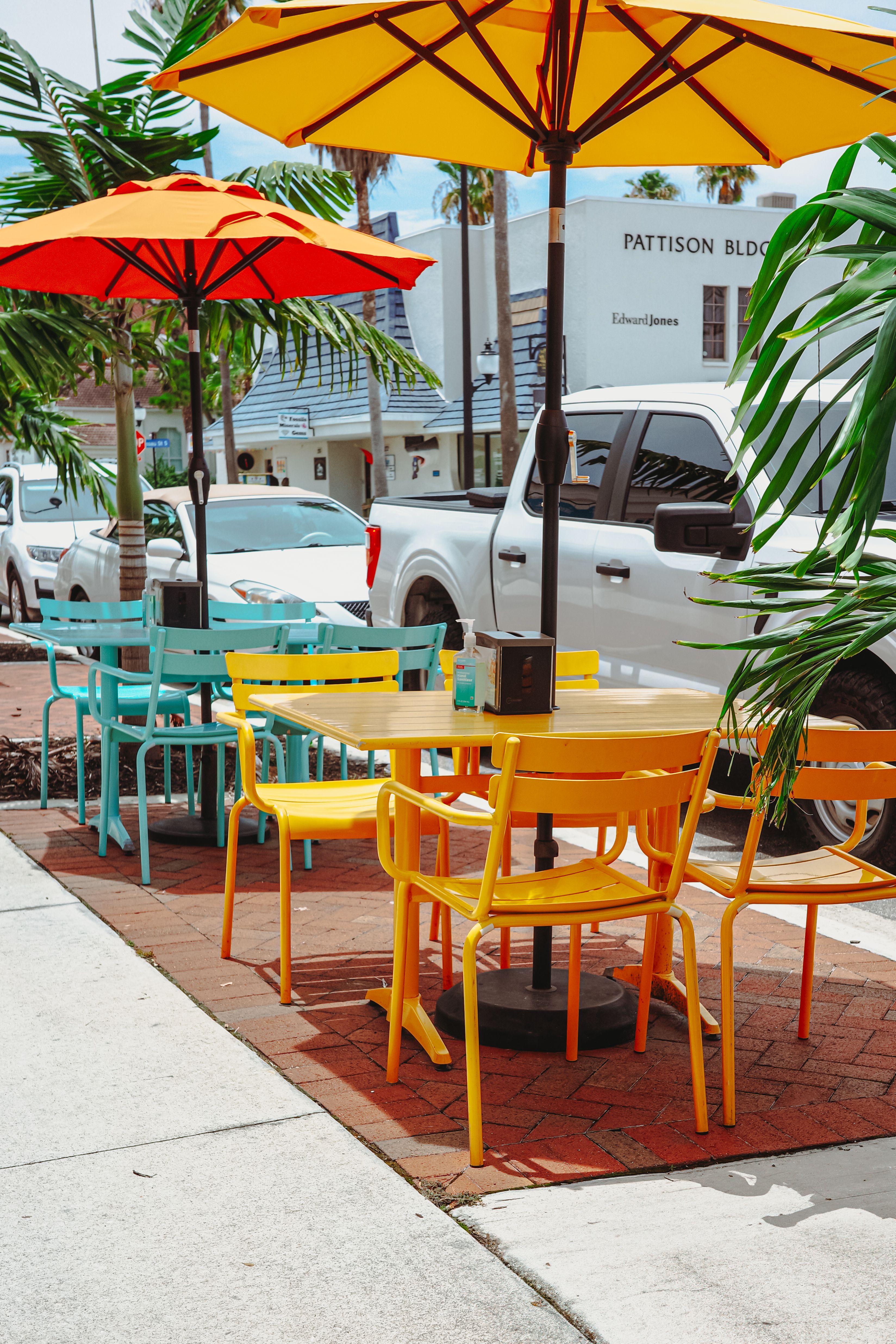 Colorful Outdoor Cafe Seating on a Sunny Day · Free Stock Photo