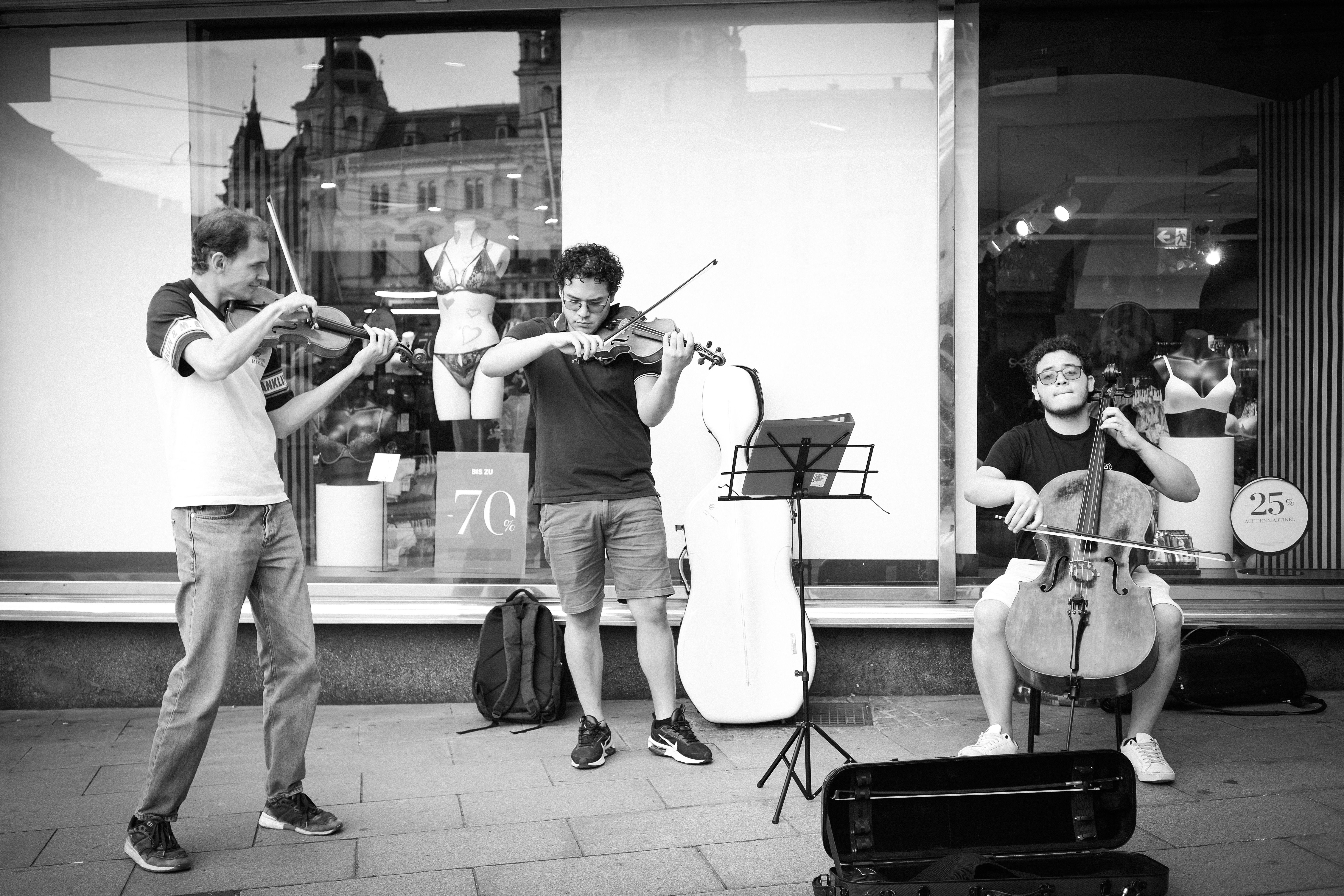 Street Musicians Playing in Urban Setting · Free Stock Photo