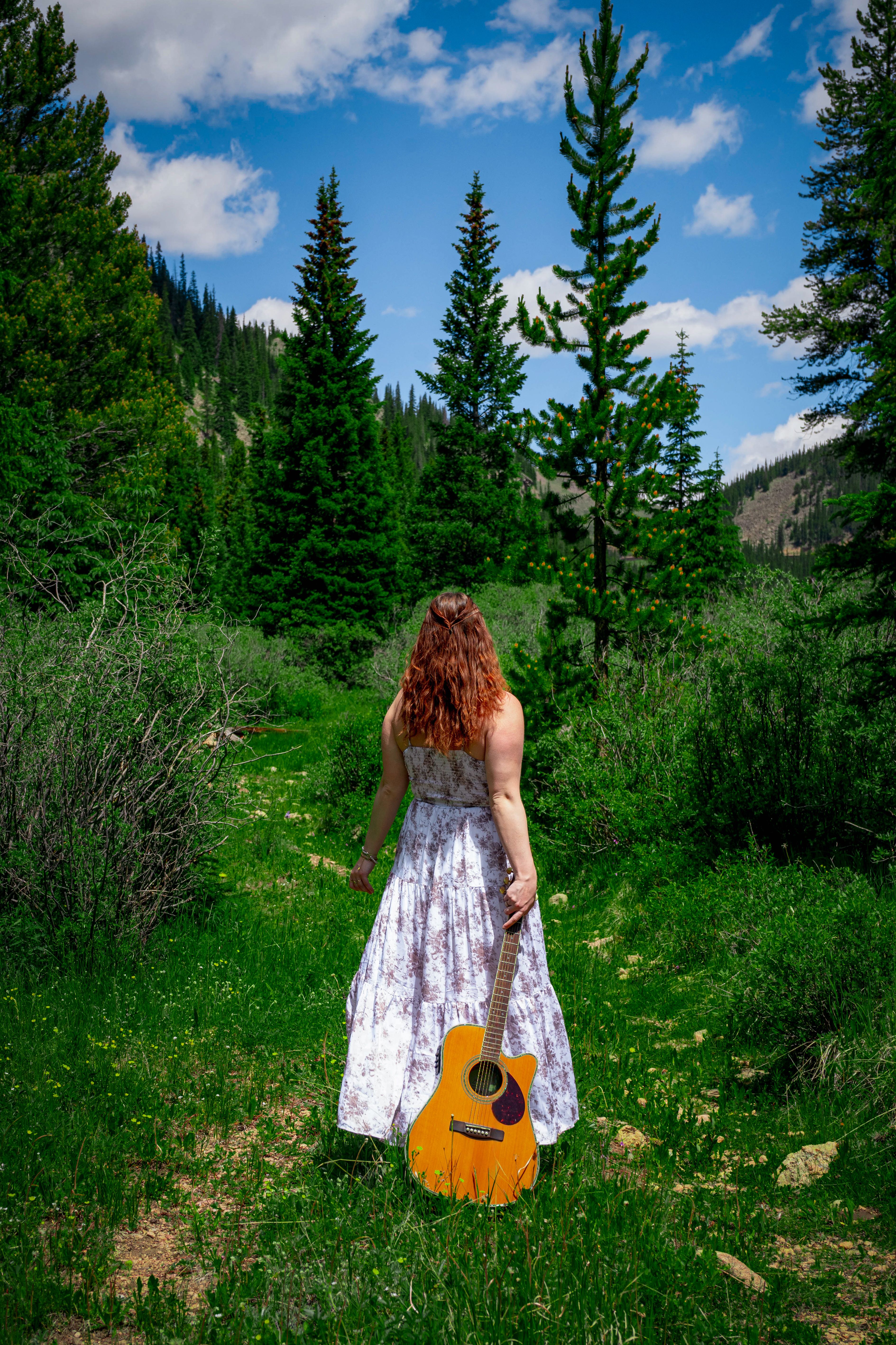 Woman with Guitar in Scenic Colorado Forest · Free Stock Photo