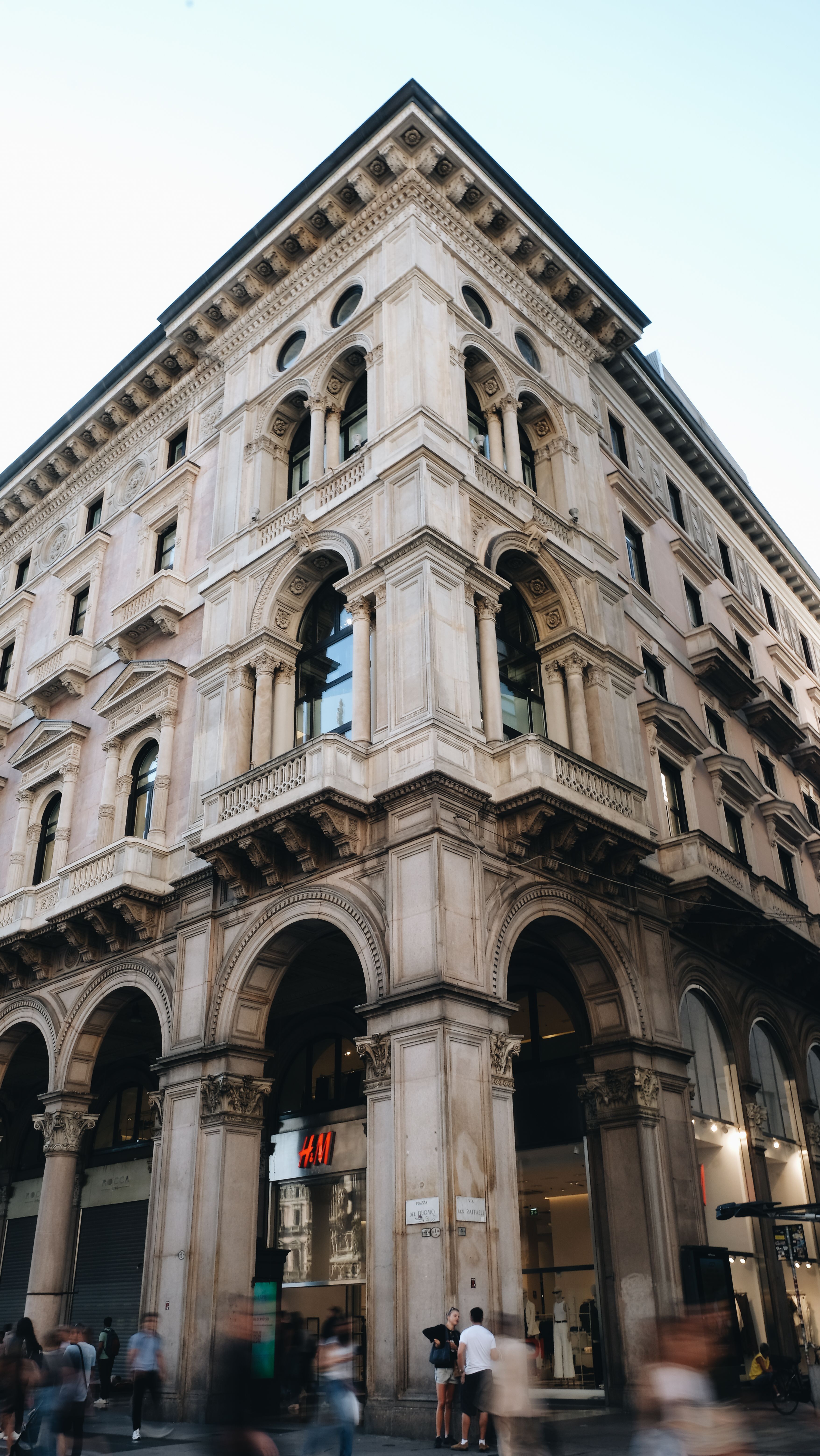 Historic European Architecture on Busy Street Corner · Free Stock Photo