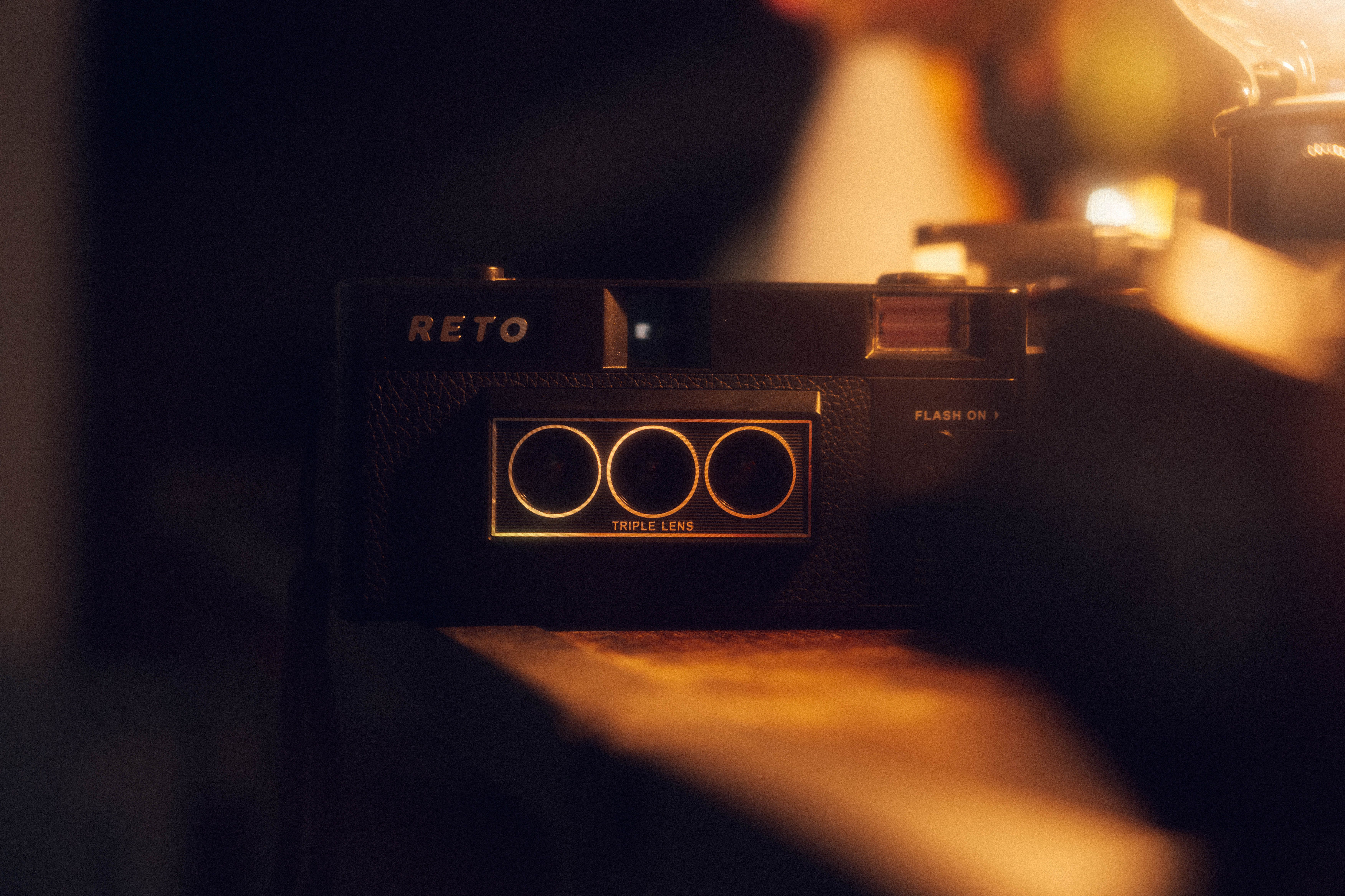 Vintage Camera with Triple Lens in Warm Lighting · Free Stock Photo