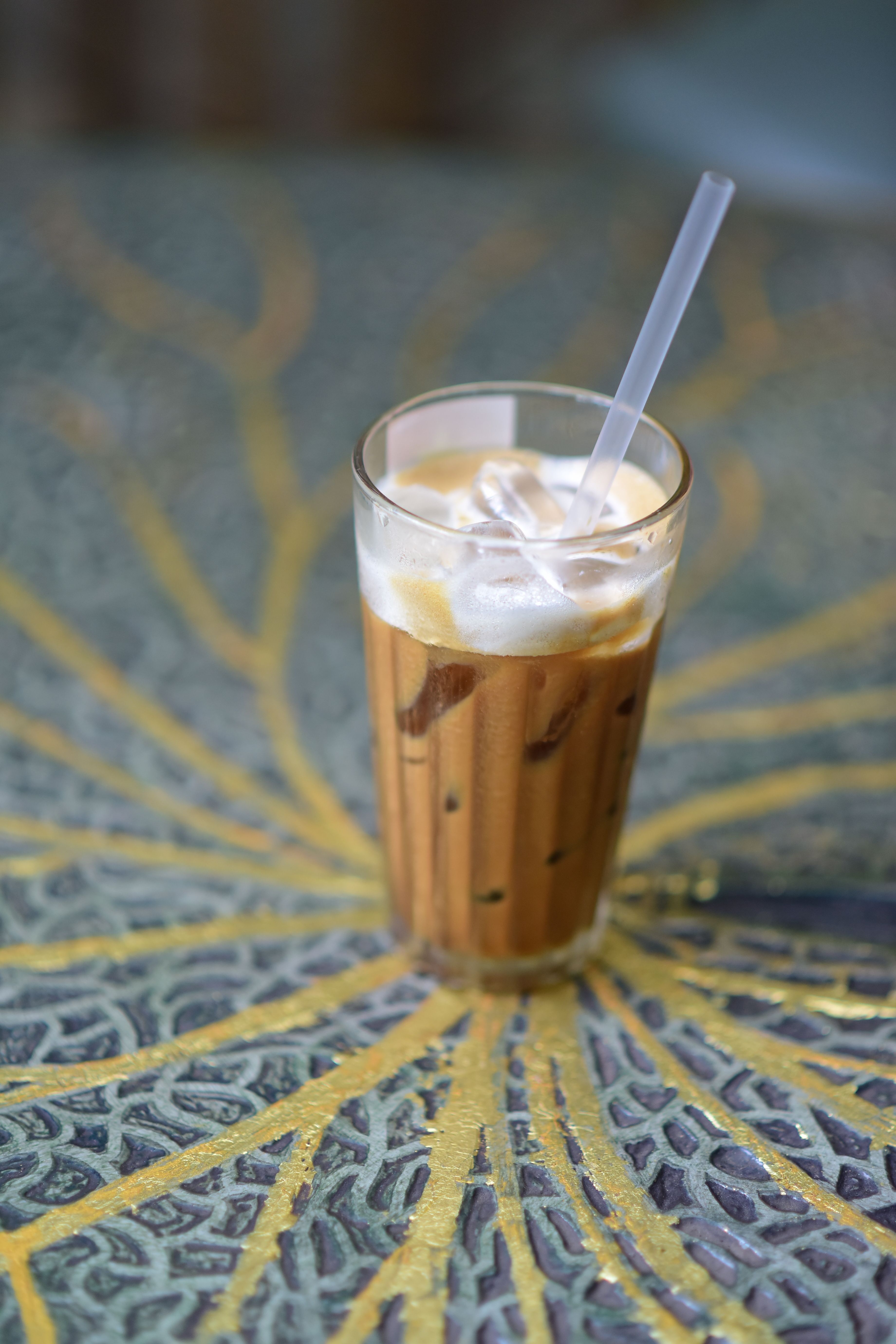 Refreshing Iced Coffee in Glass on Artistic Table · Free Stock Photo