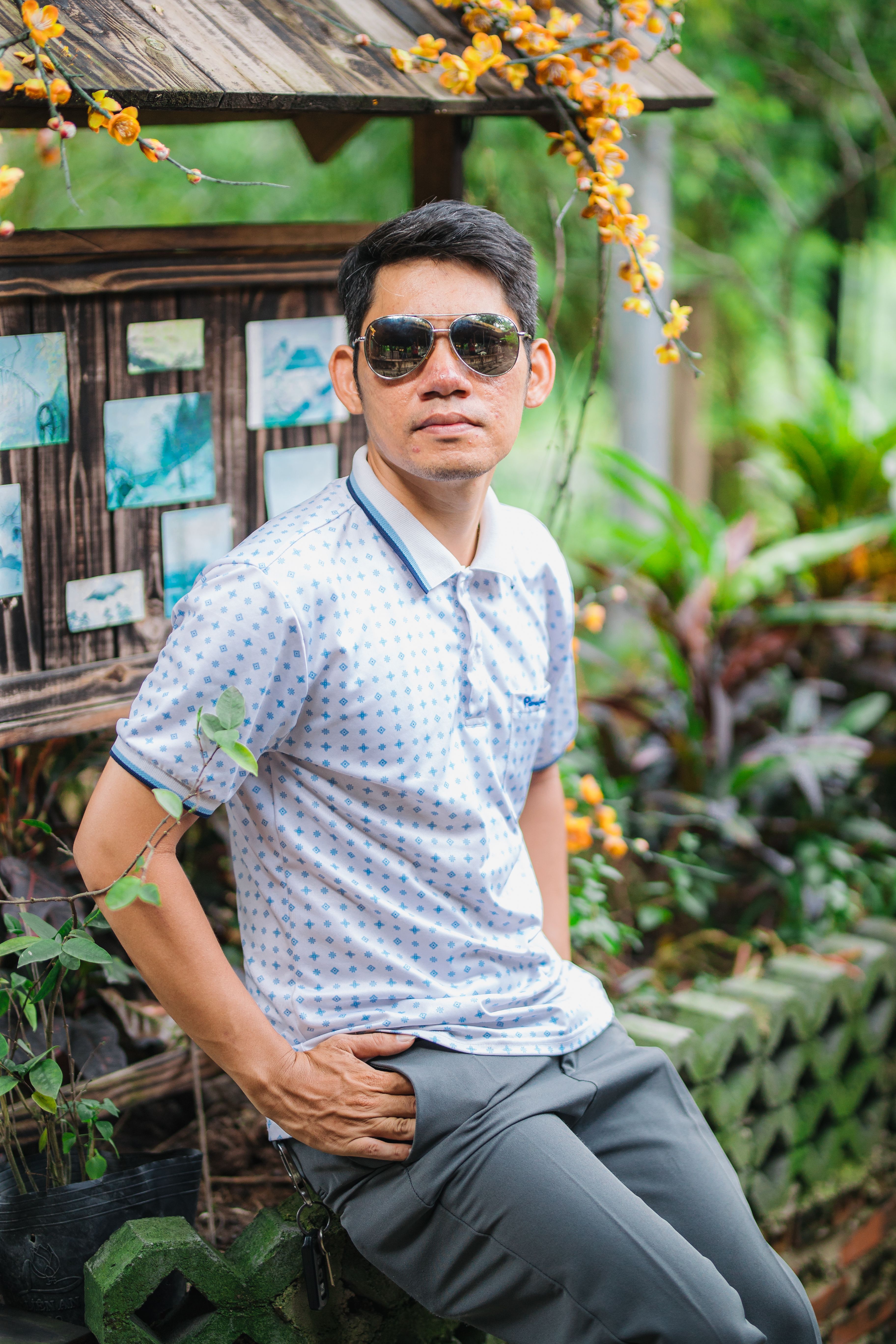 Man Standing Near Brown Wooden Frame · Free Stock Photo
