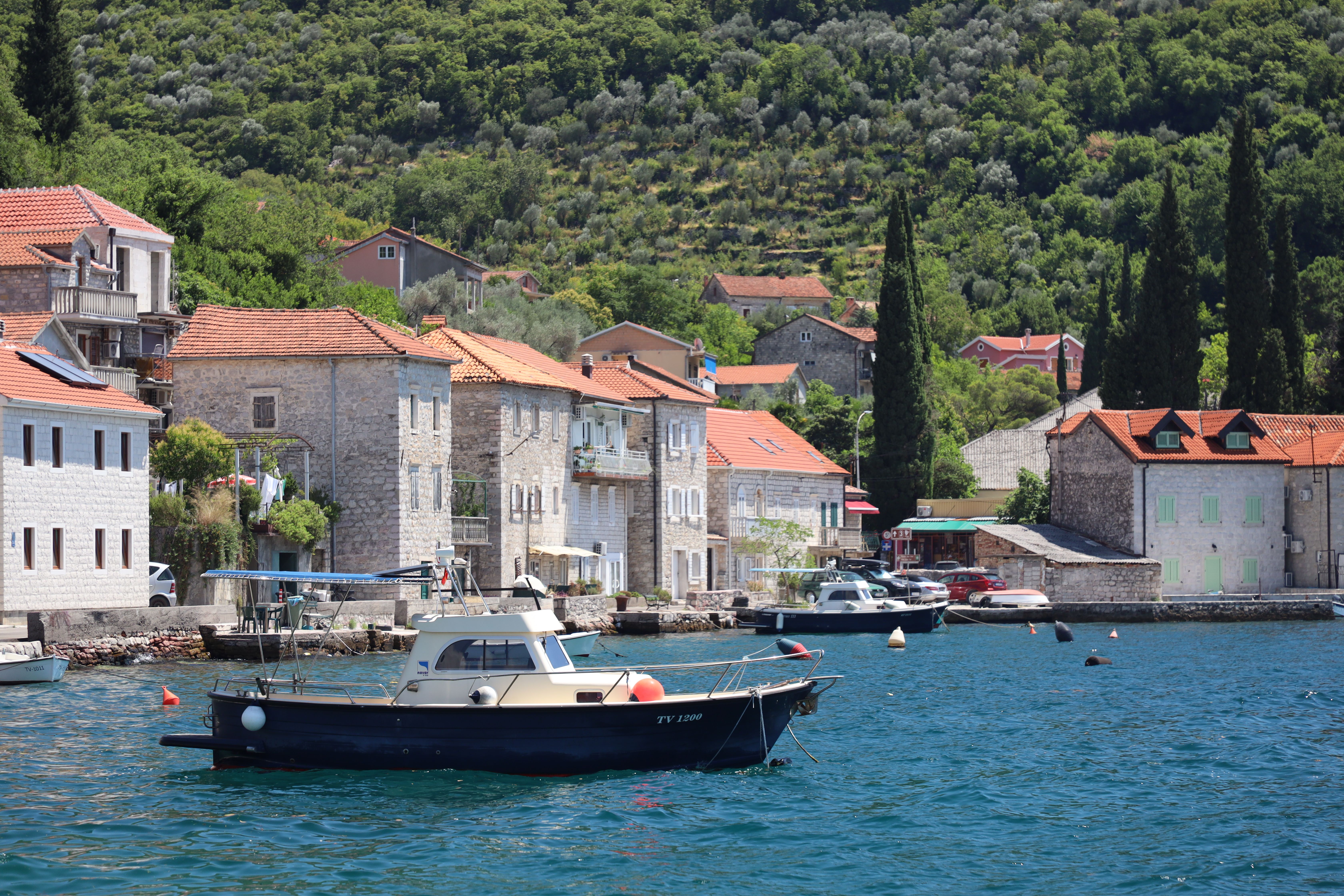 Scenic Coastal Village with Boats and Homes · Free Stock Photo