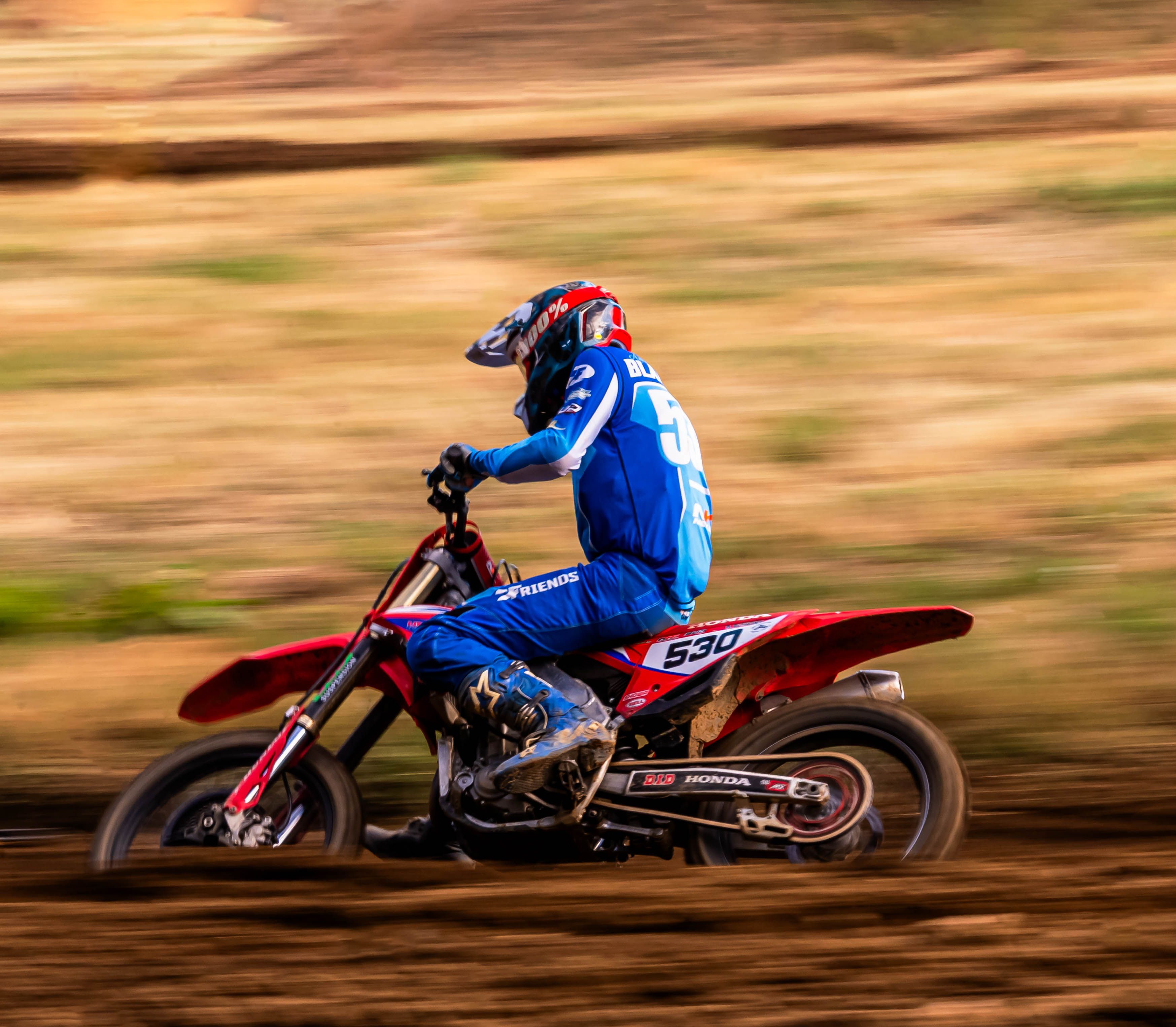 High-Speed Motocross Race on Dirt Track · Free Stock Photo