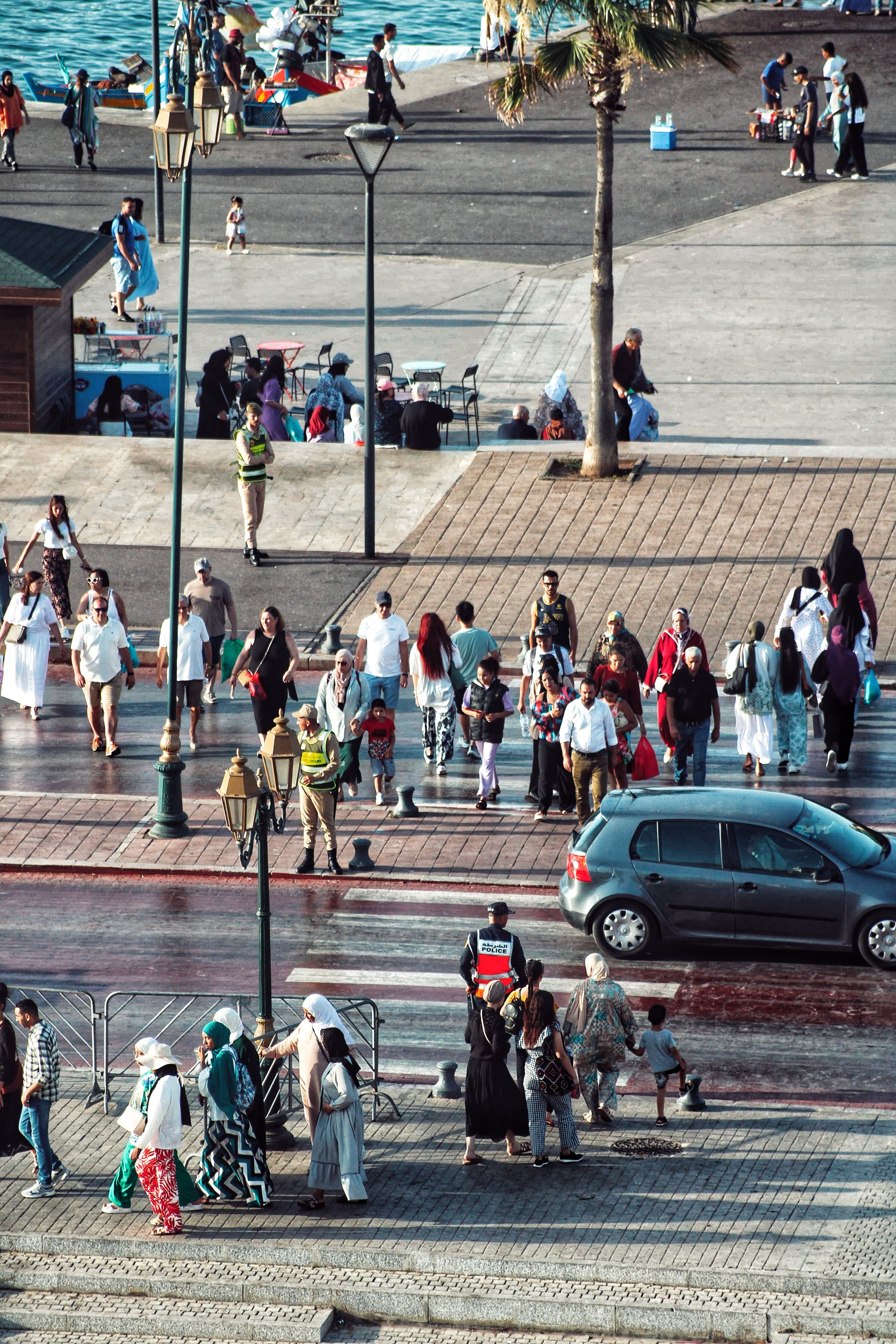 Busy Urban Street Scene with Pedestrians and Traffic · Free Stock Photo
