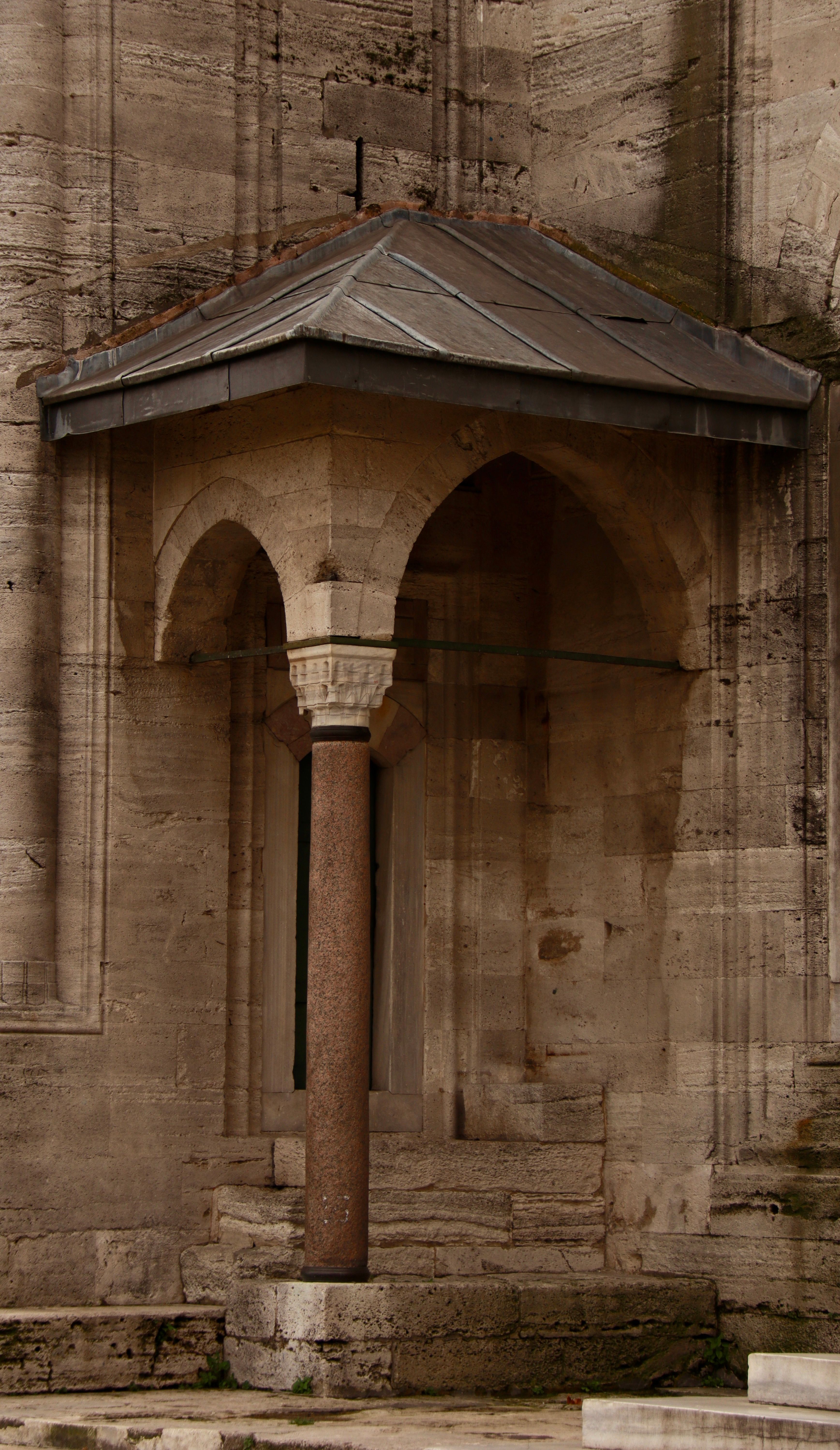 Historic Stone Architecture with Column and Archway · Free Stock Photo