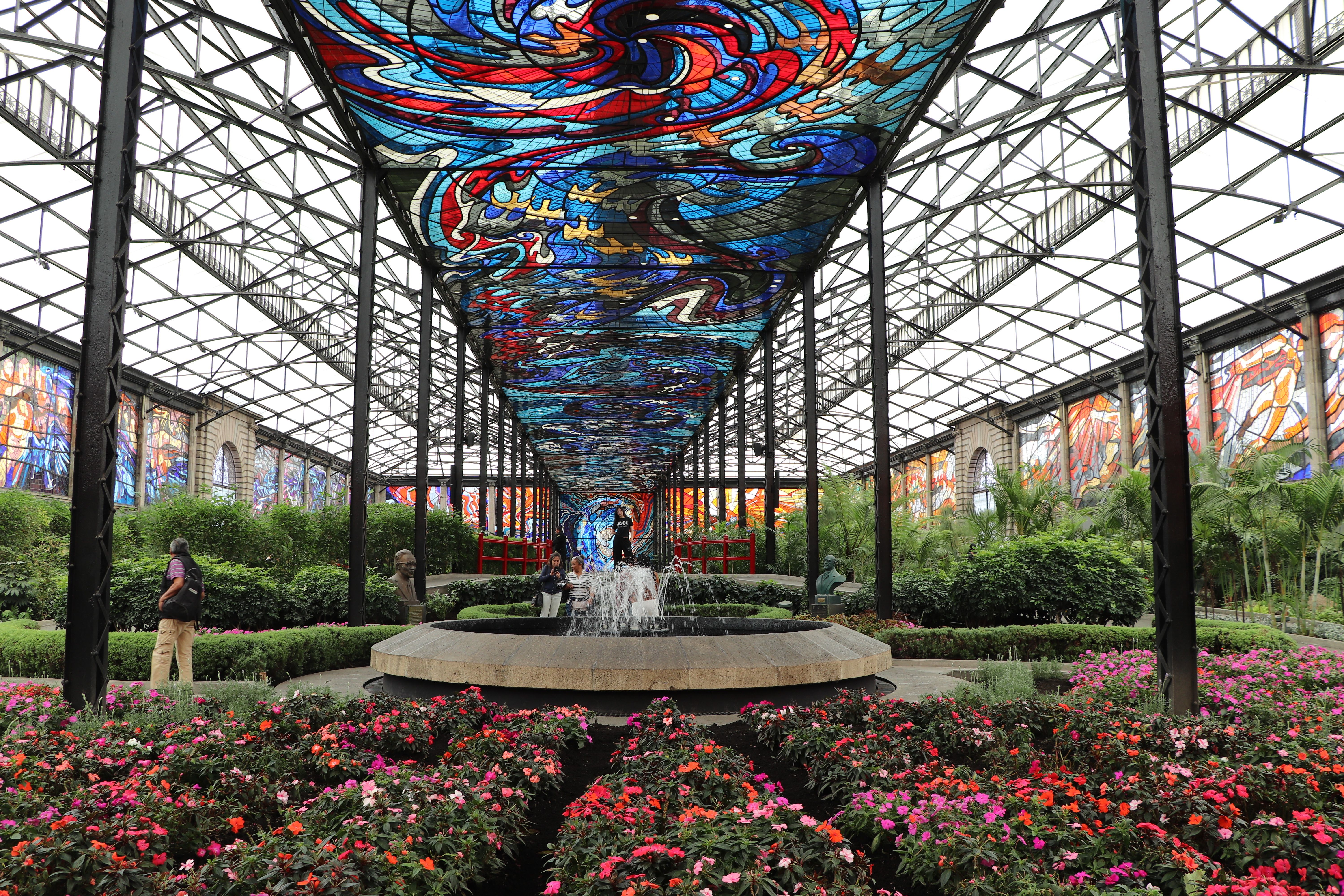 Vibrant Stained Glass Art in Botanical Garden · Free Stock Photo