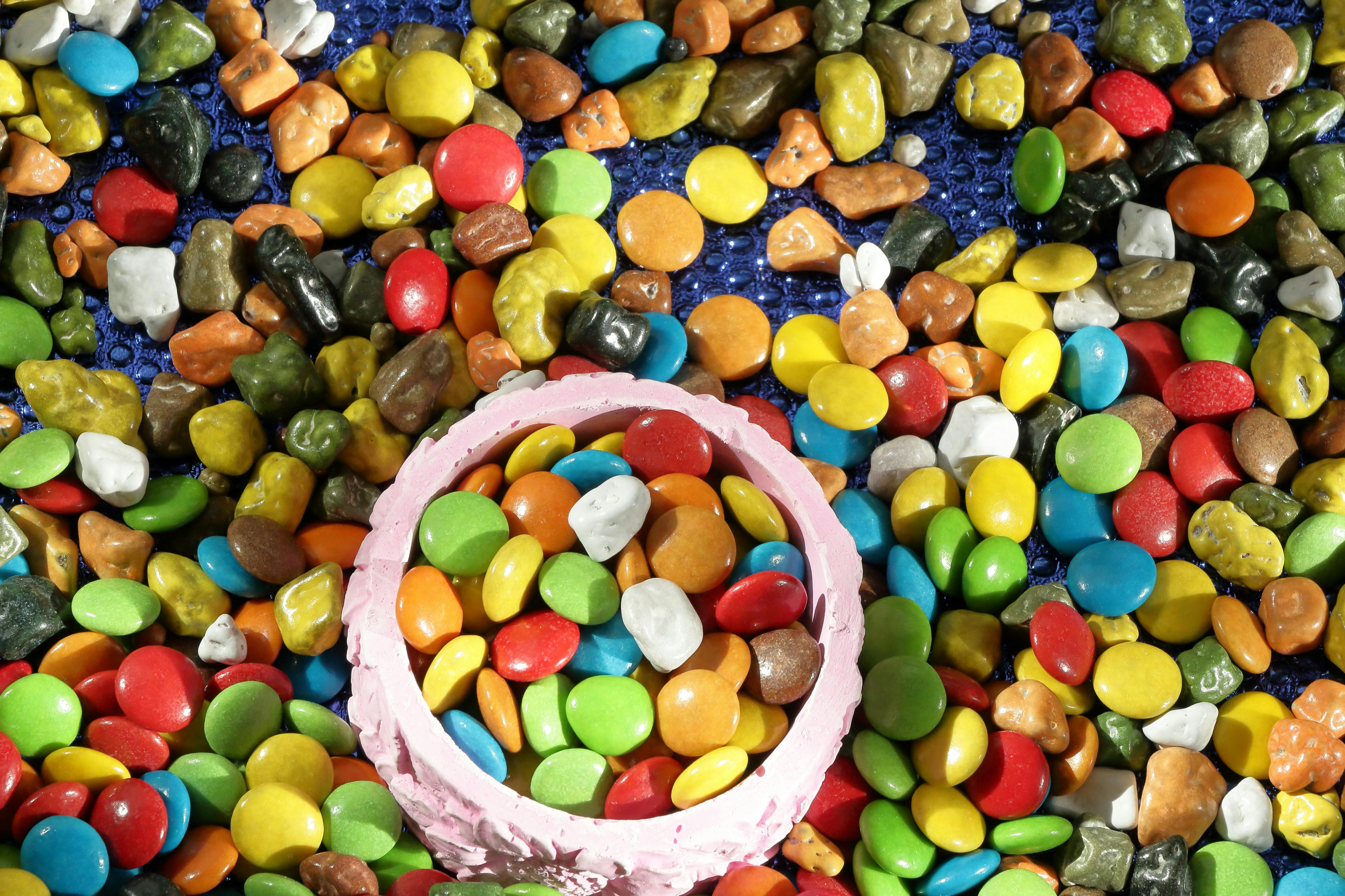 Colorful Candy-Coated Chocolate Pebbles in Bowl · Free Stock Photo