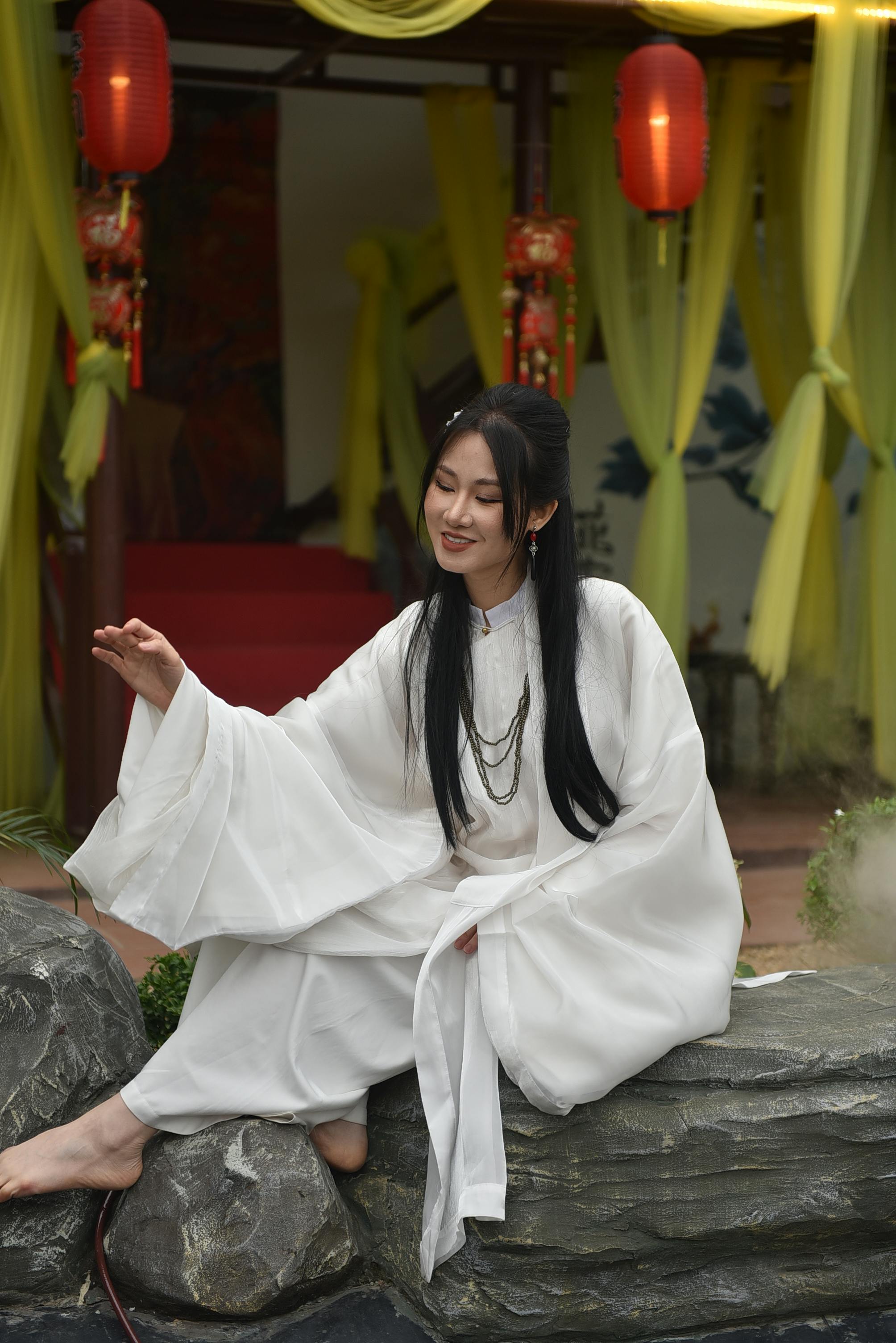Traditional Asian Woman in Cultural Attire Outdoors · Free Stock Photo
