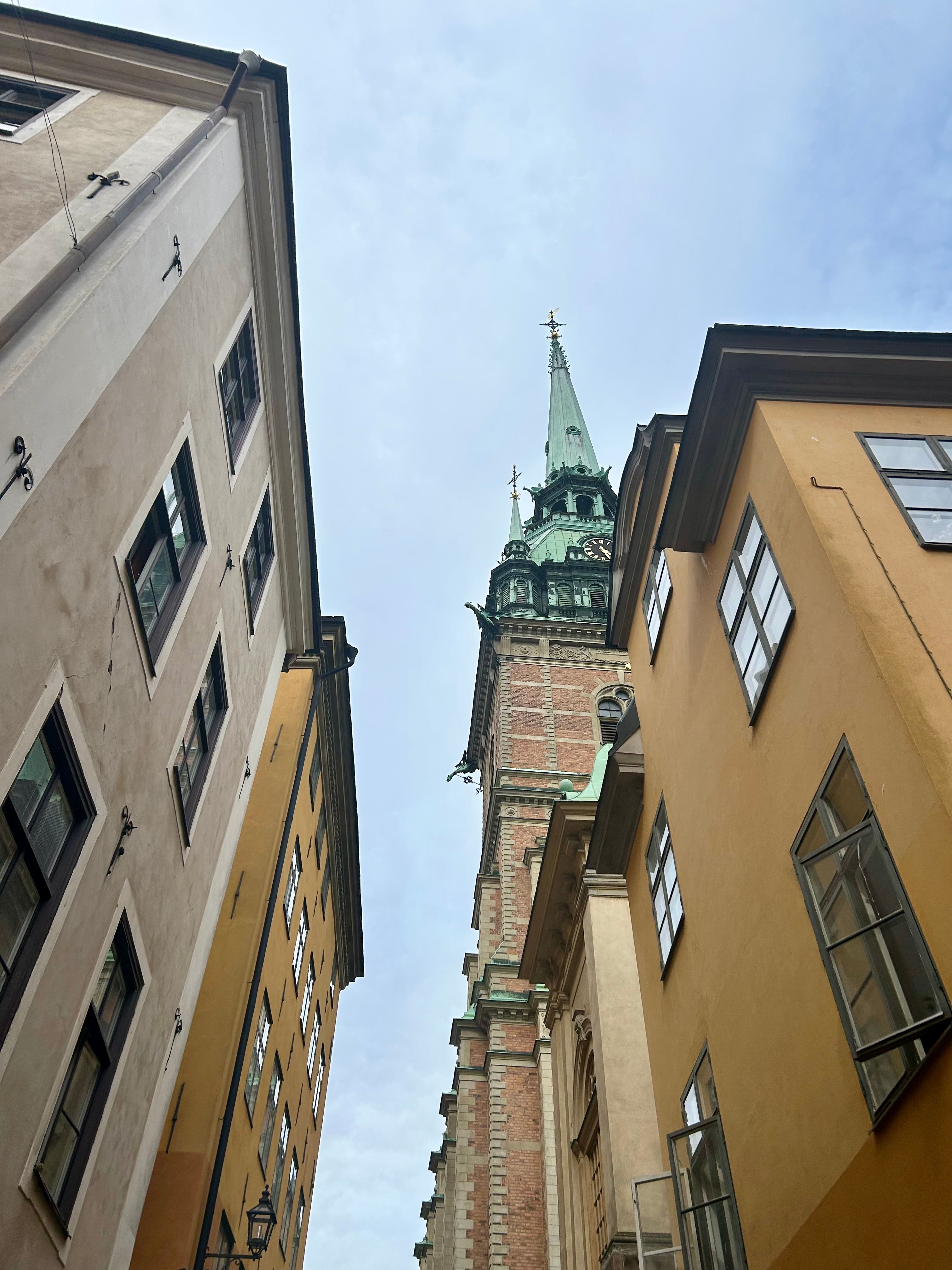 Iconic Spire View in Stockholm's Gamla Stan · Free Stock Photo