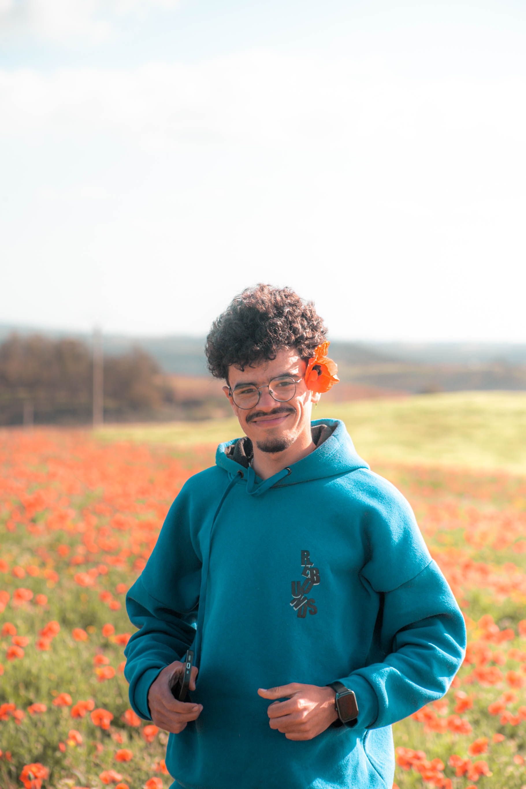 Joyful Man in Flower Field Embracing Nature · Free Stock Photo