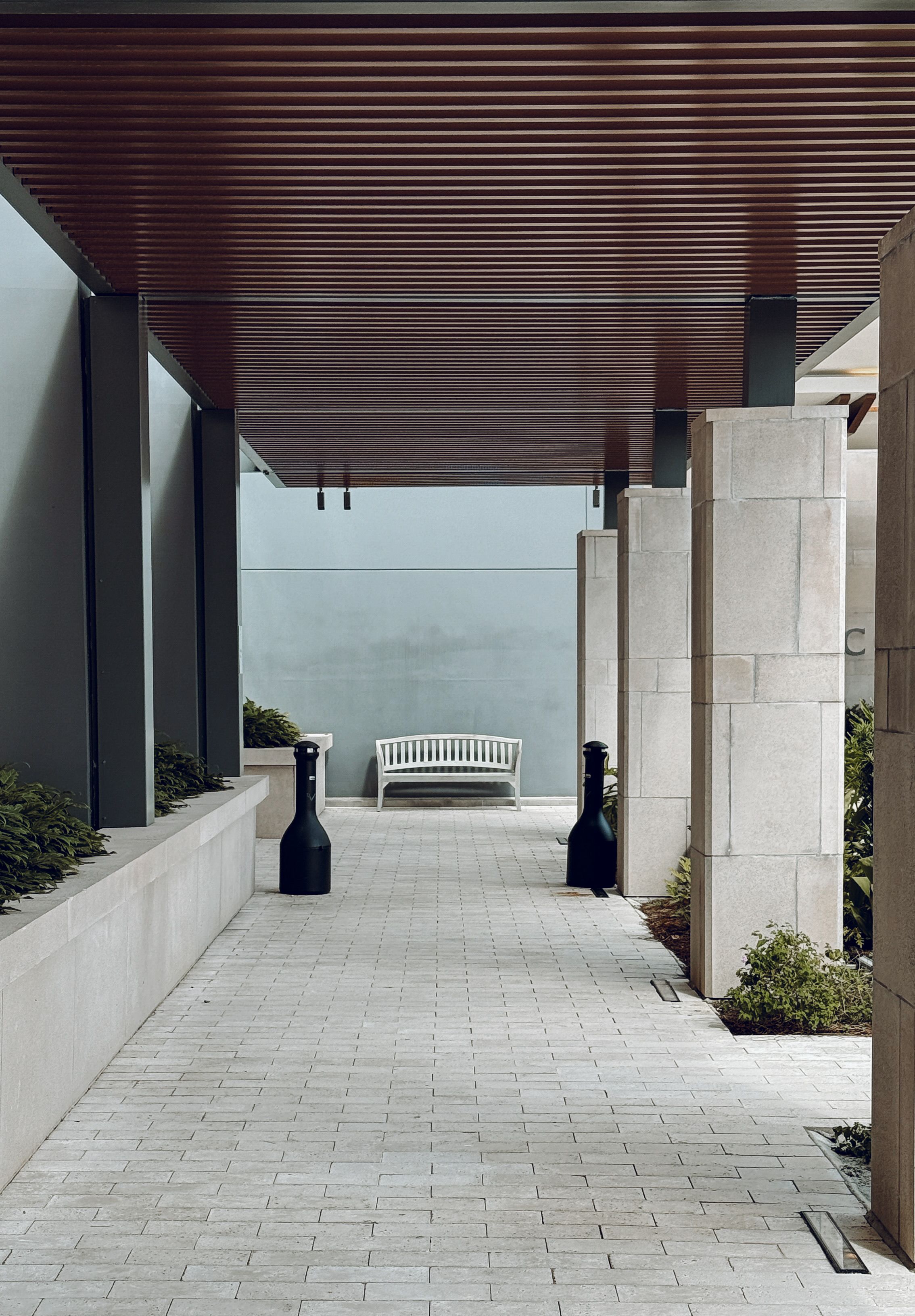 Modern Architectural Walkway with Bench · Free Stock Photo