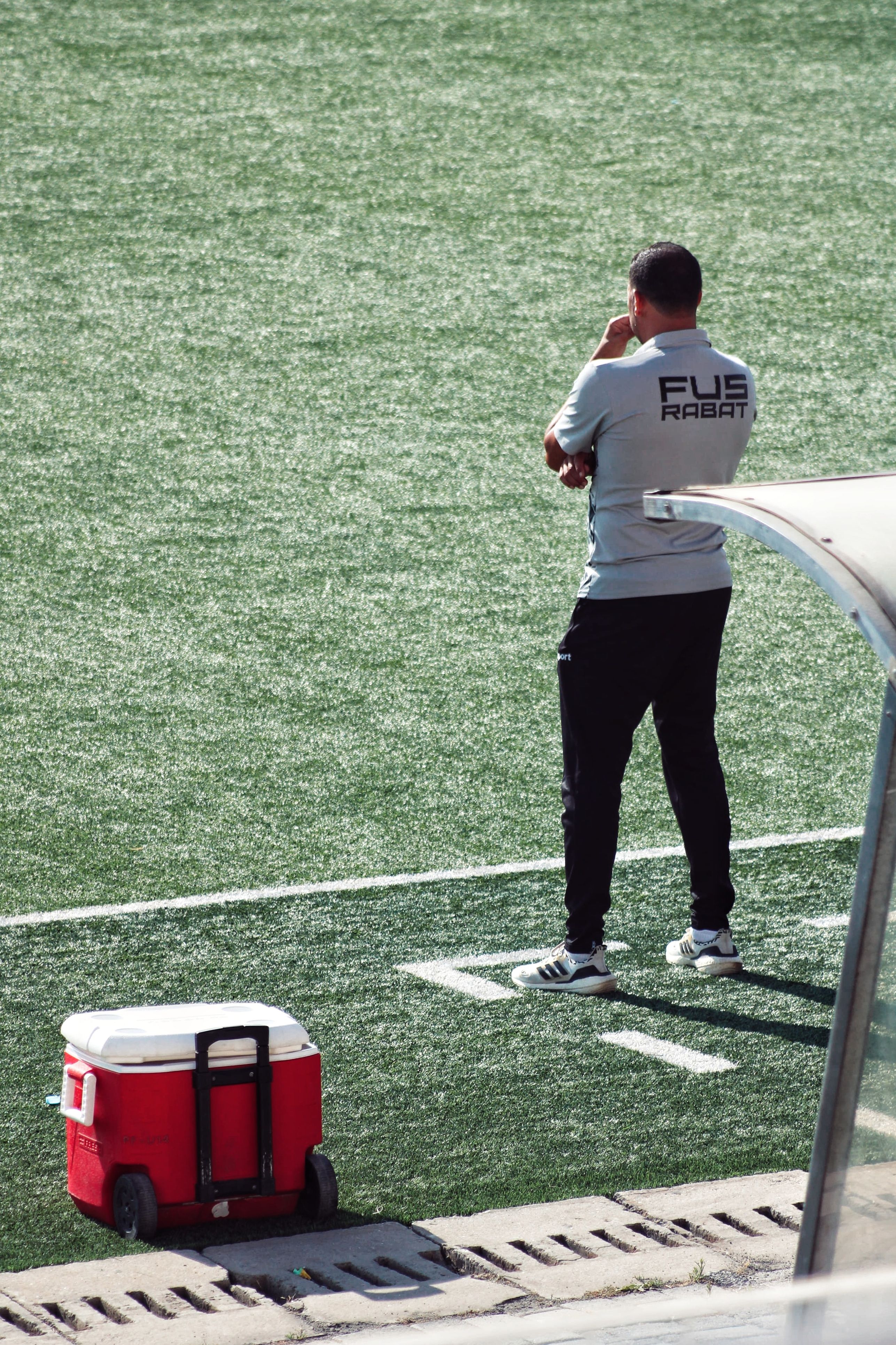 Football Coach on Sidelines During Match · Free Stock Photo