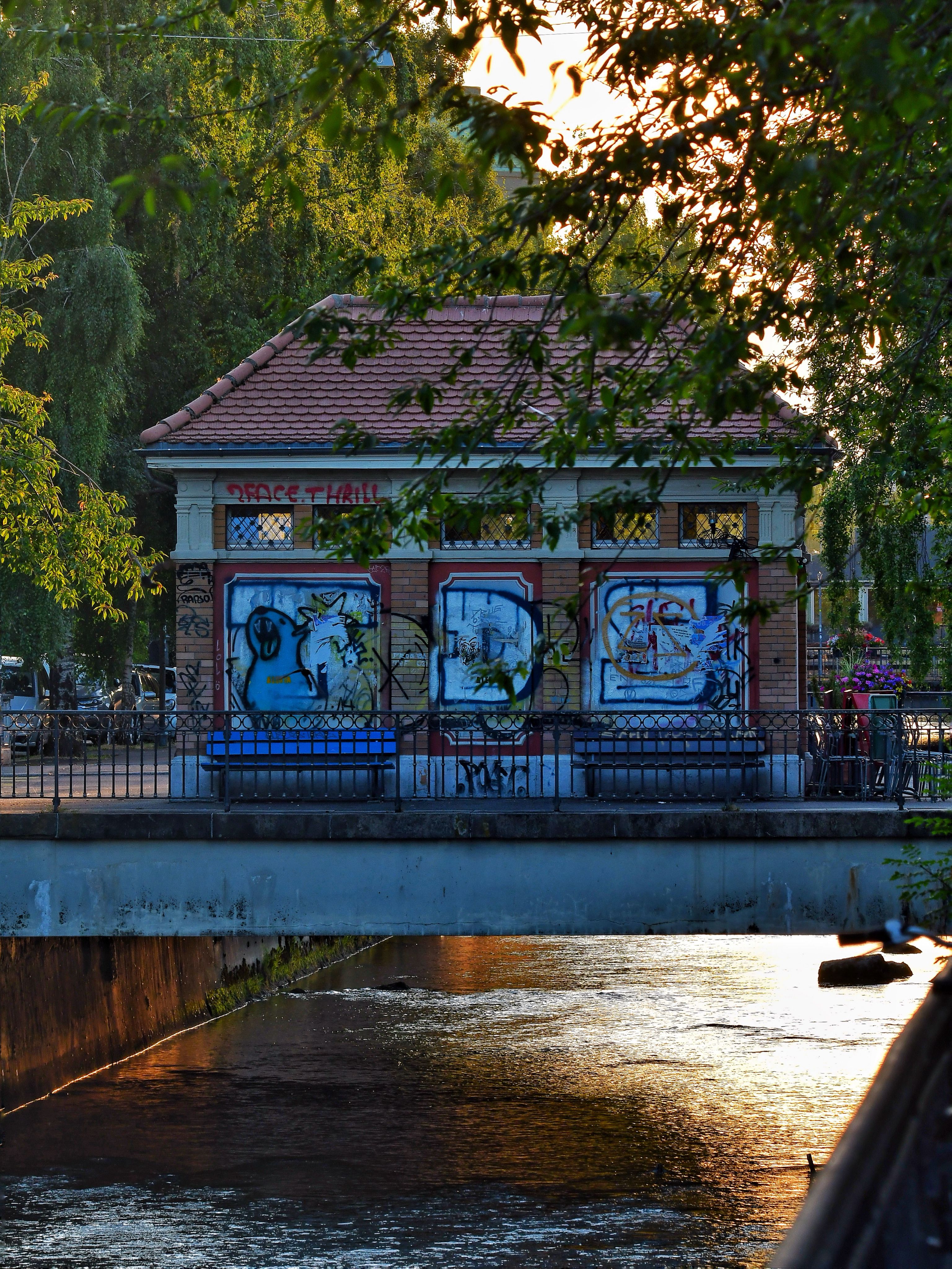 Charming Bridge with Graffiti Art at Sunset · Free Stock Photo