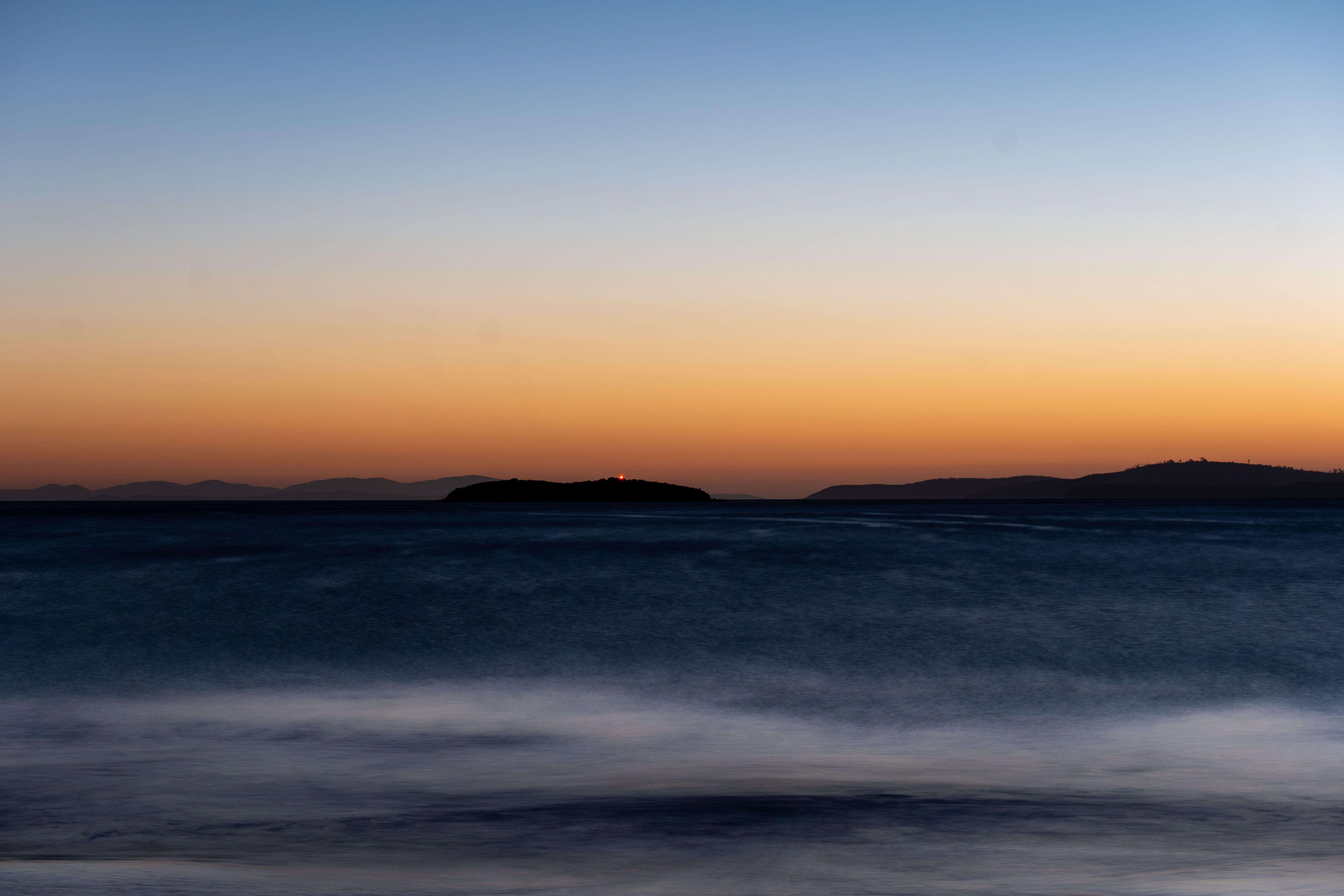 Tranquil Tasmanian Sunset Over Calm Waters · Free Stock Photo