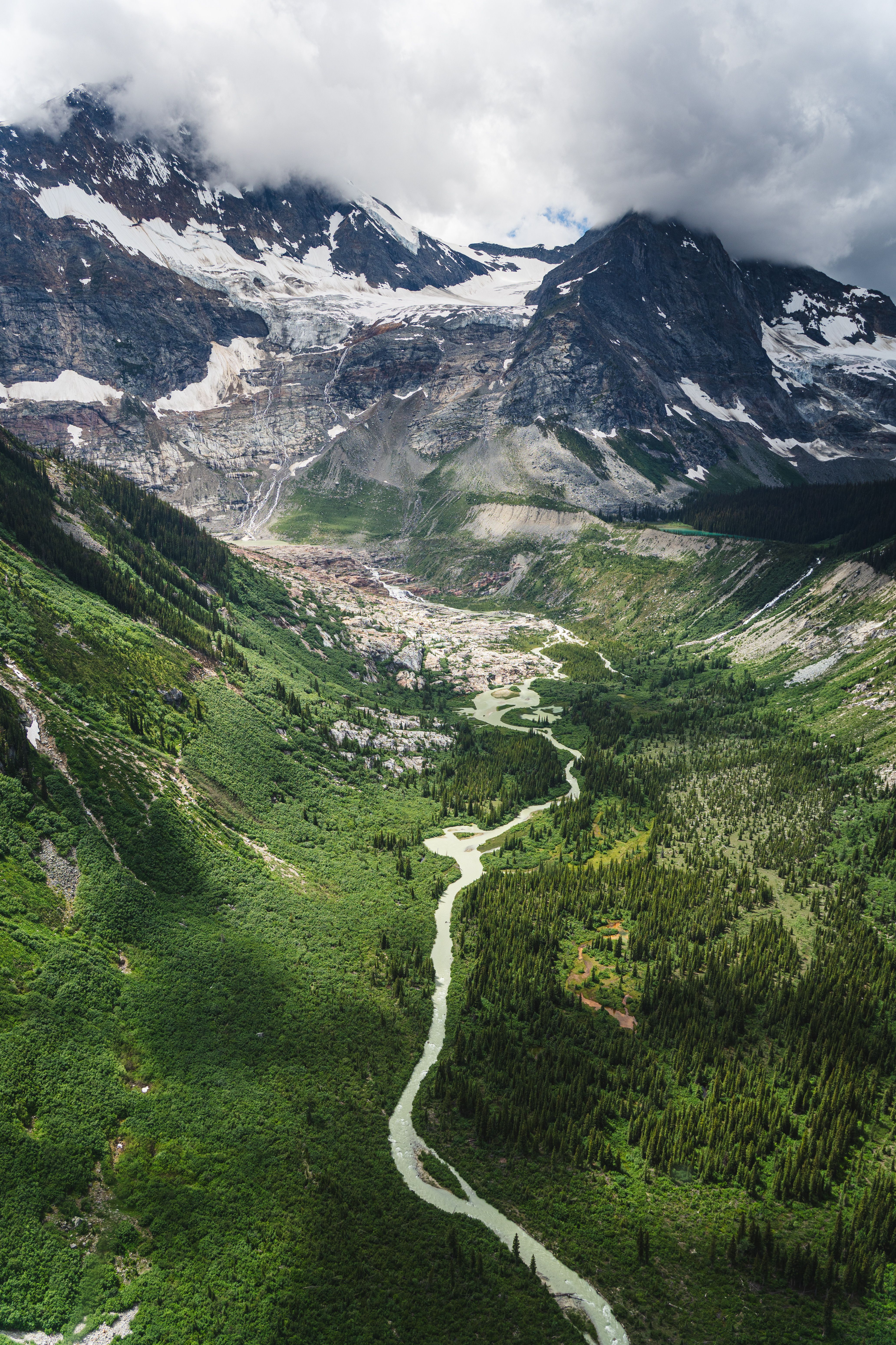 Aerial View of Verdant Valley with Mountain Range · Free Stock Photo