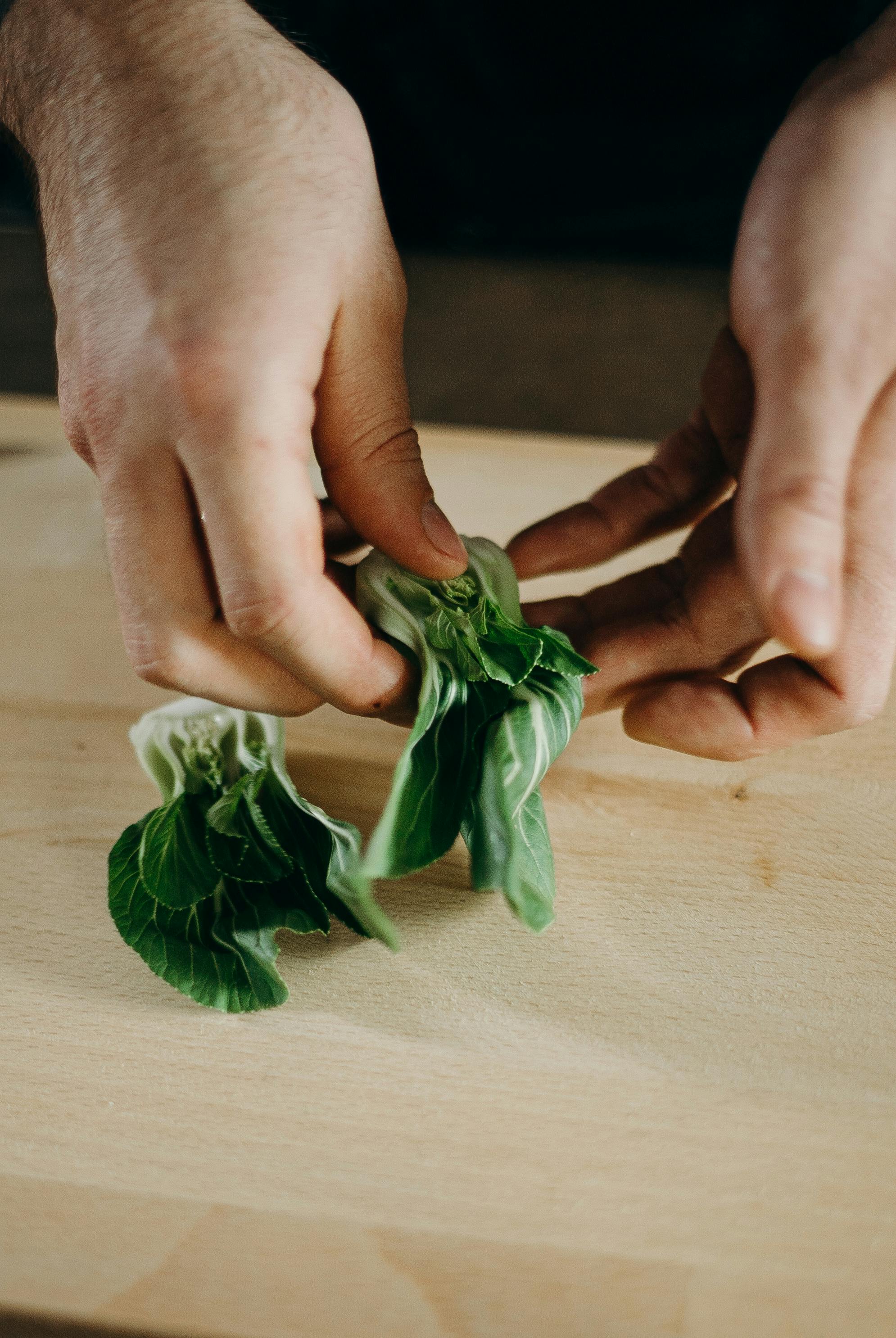 Person Pouring Seasoning on Green Beans on Bowl · Free Stock Photo
