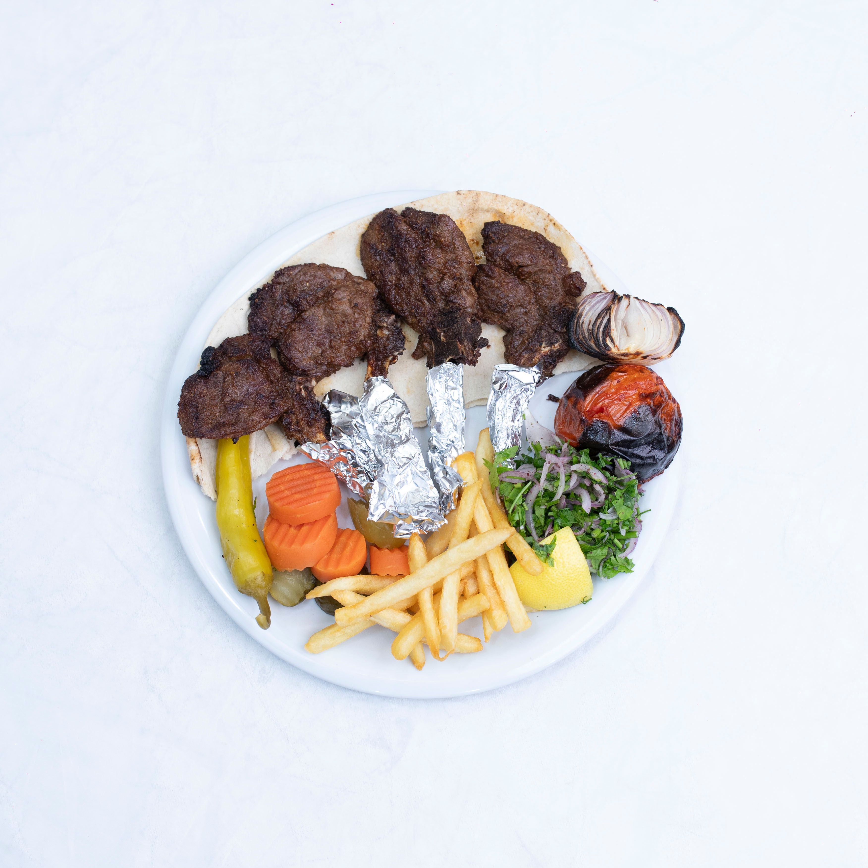 Mixed Grill Plate with Vegetables and Fries · Free Stock Photo