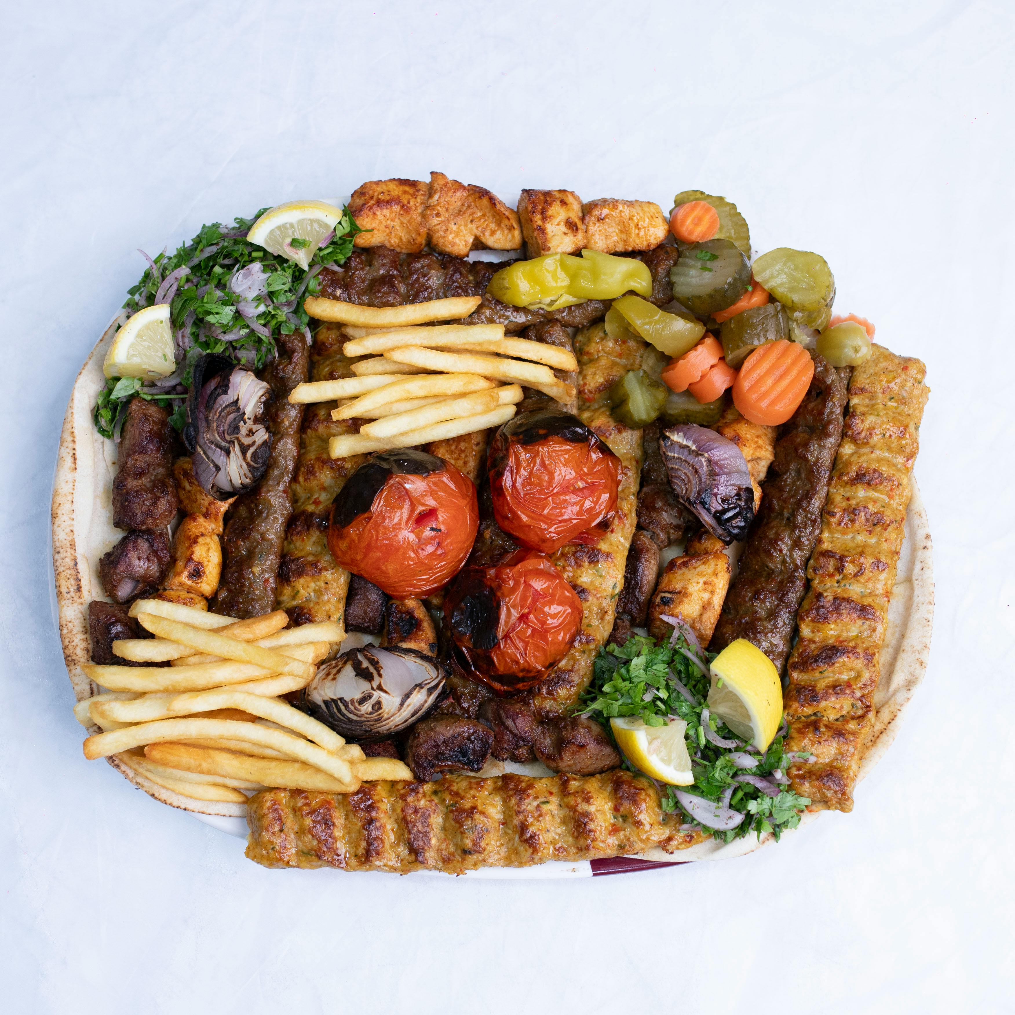 Mixed Middle Eastern Grill Platter with Vegetables · Free Stock Photo