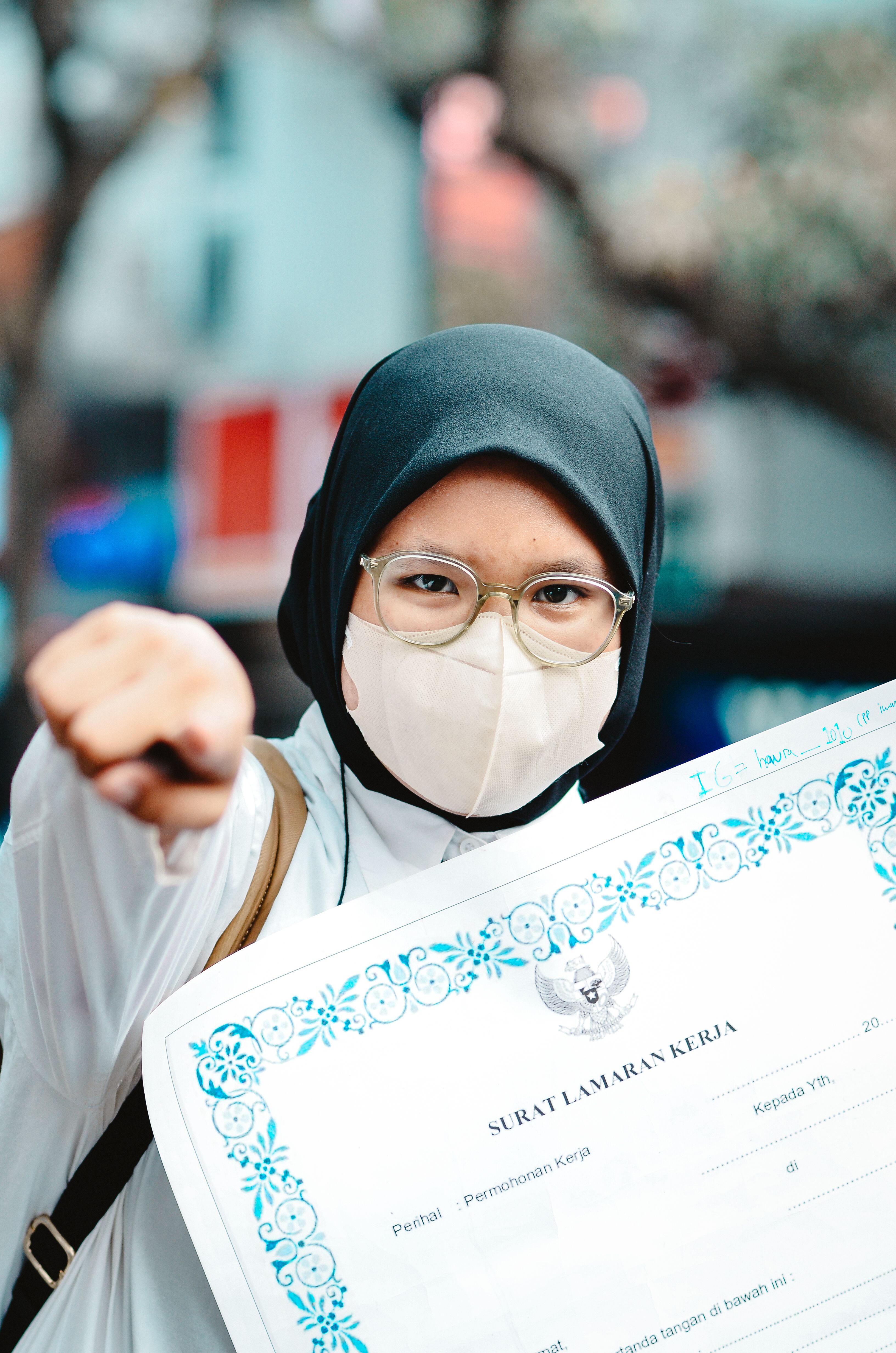 Young Woman Holding Job Application Certificate · Free Stock Photo