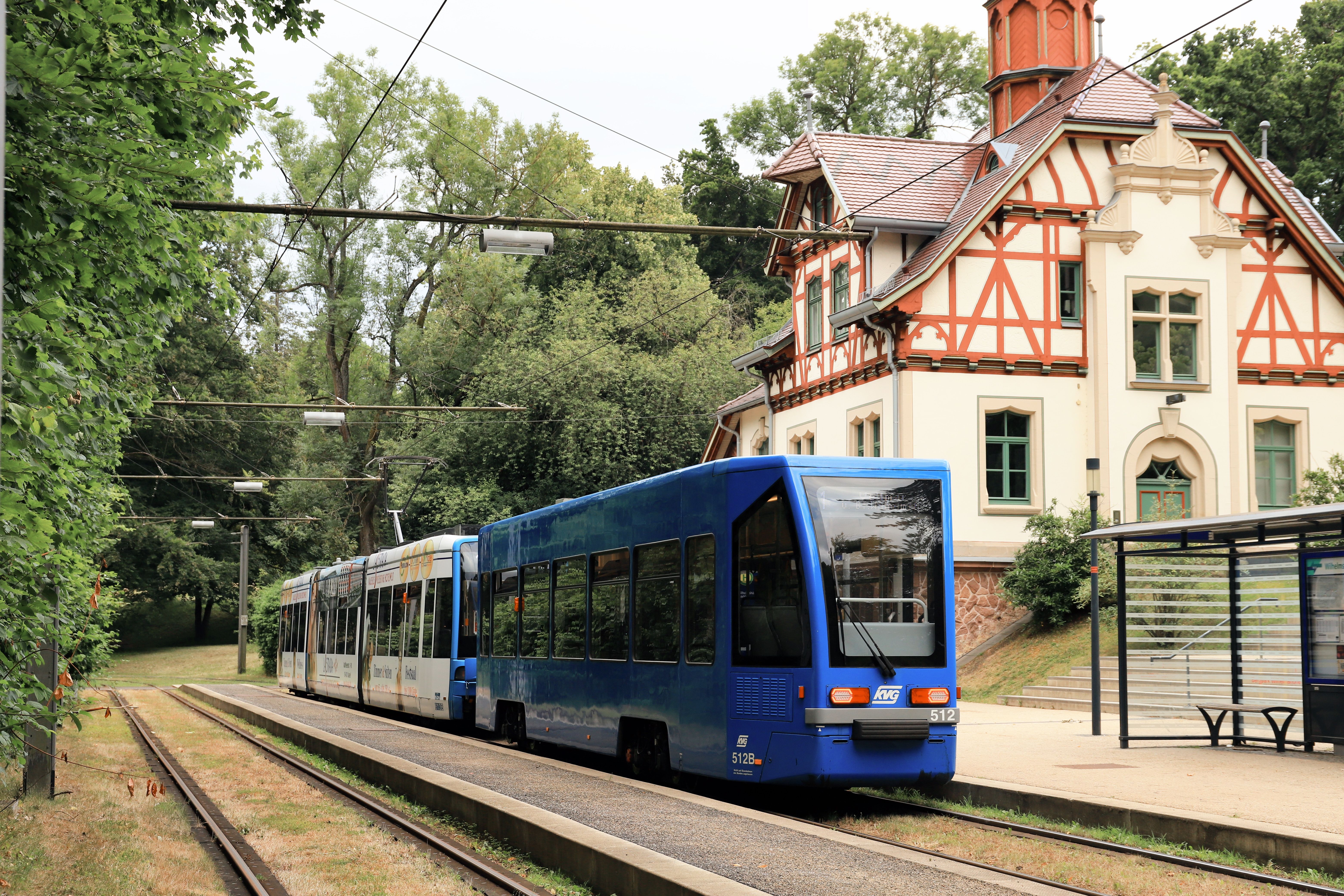 Tram Approaching Historic Station in Kassel · Free Stock Photo