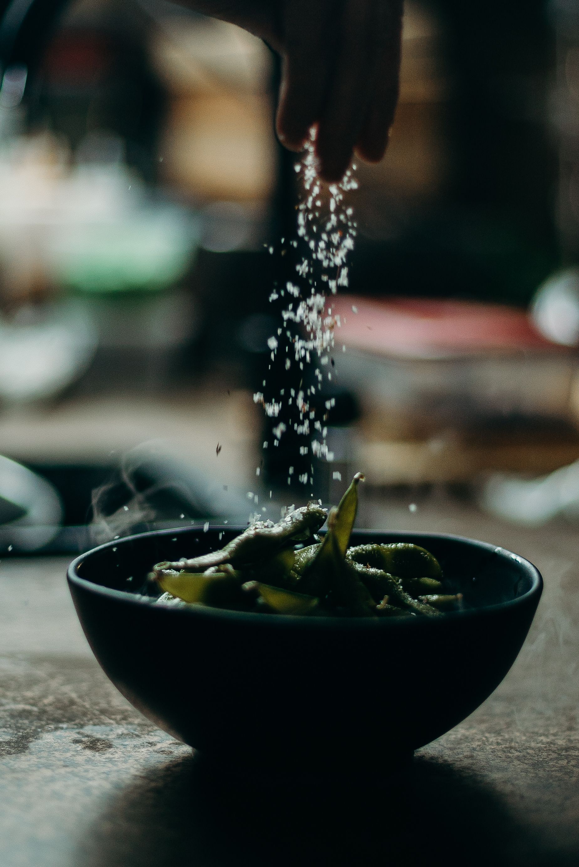 Person Pouring Seasoning on Green Beans on Bowl · Free Stock Photo