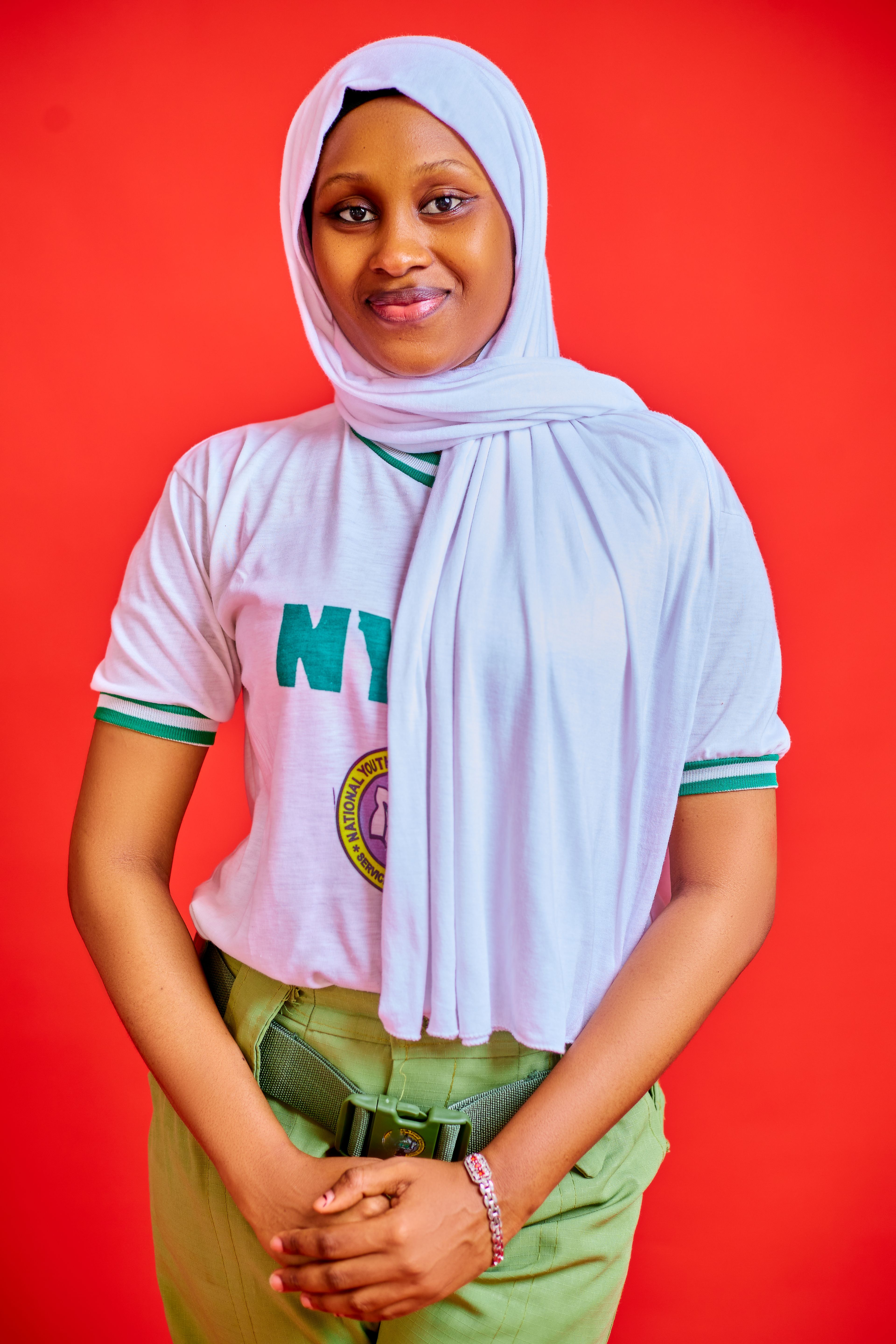 Portrait of Young Woman in NYSC Uniform with Hijab · Free Stock Photo