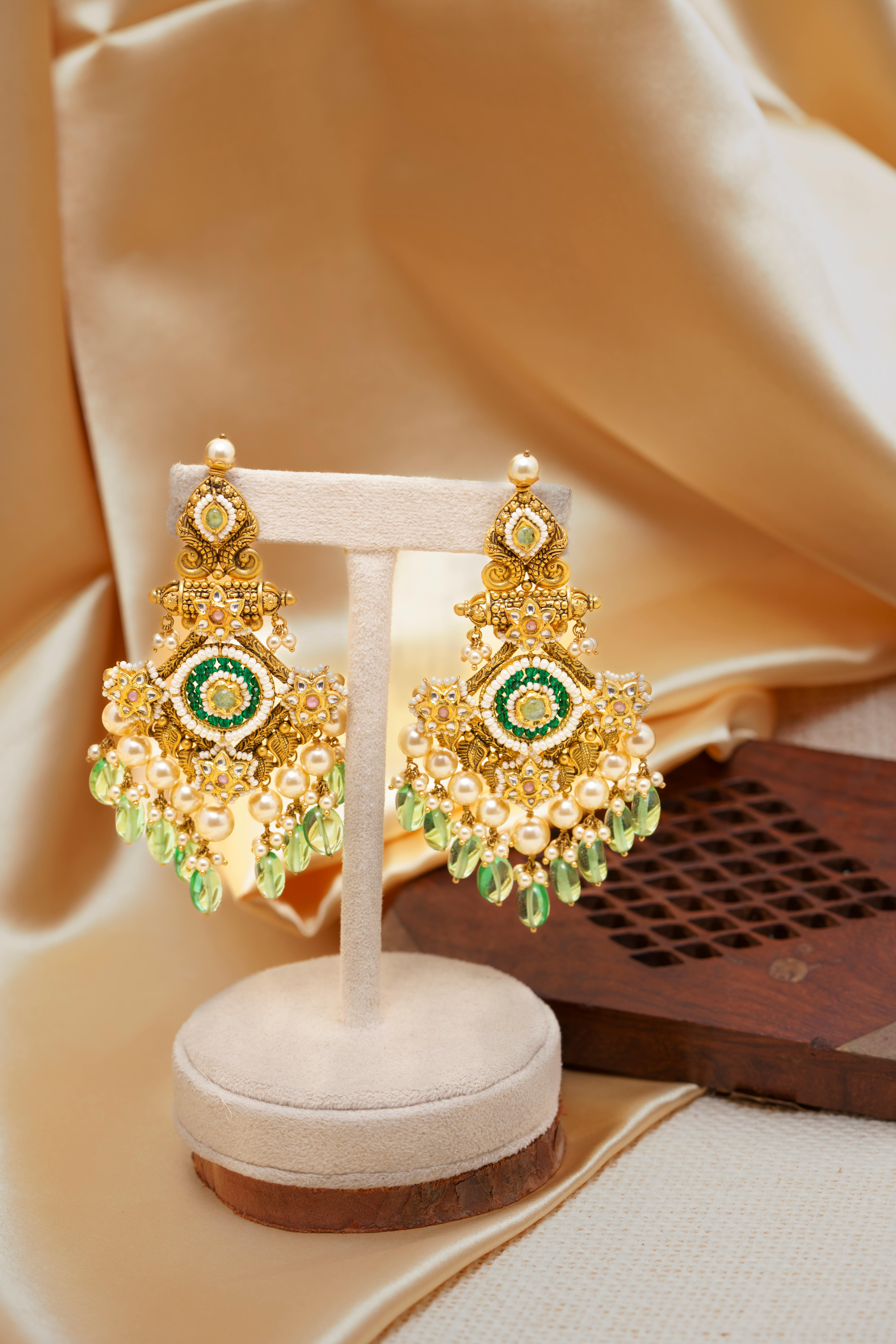 Elegant Gold and Green Chandelier Earrings · Free Stock Photo
