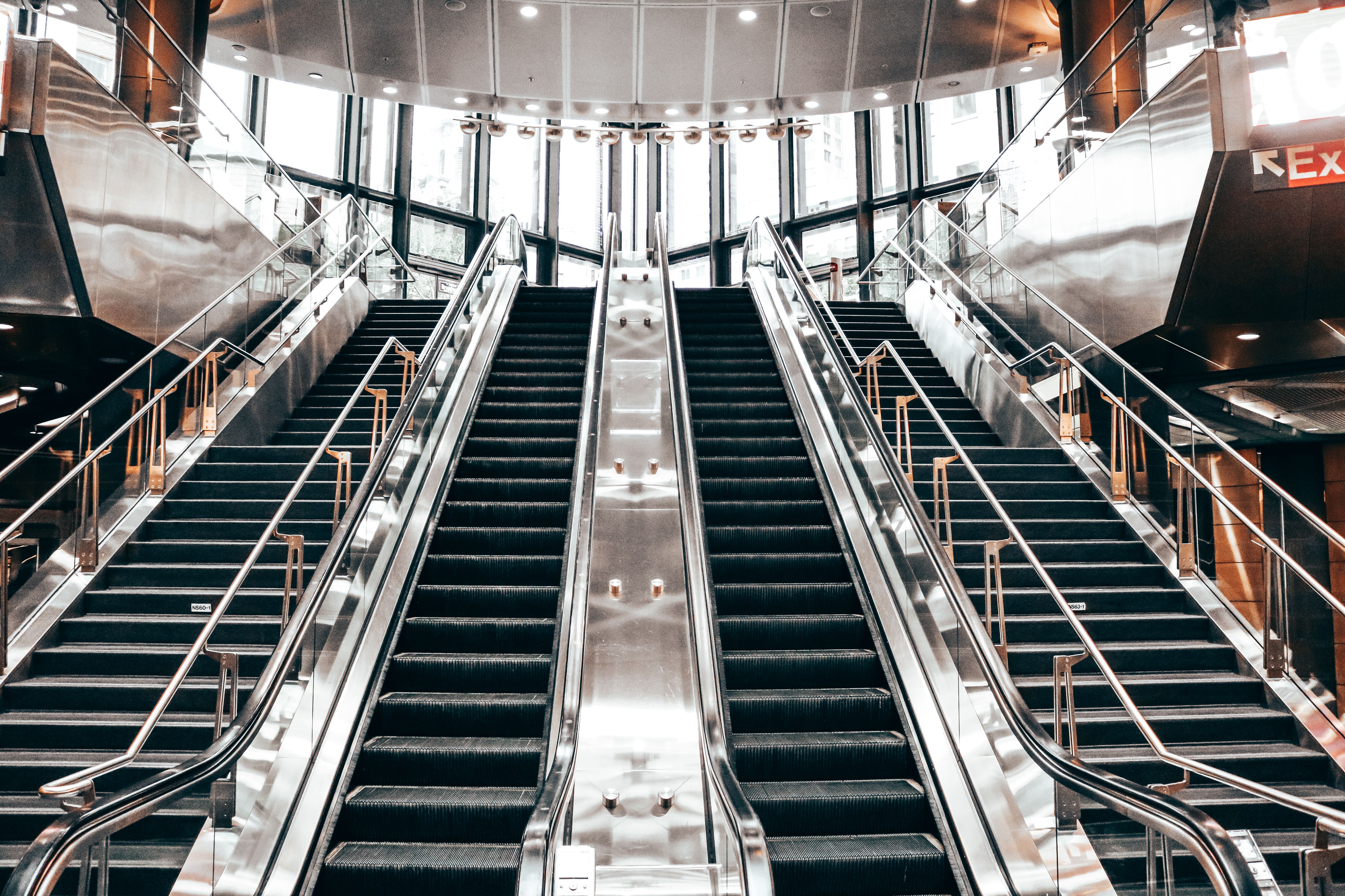 Symmetrical Escalators in Modern New York Interior · Free Stock Photo