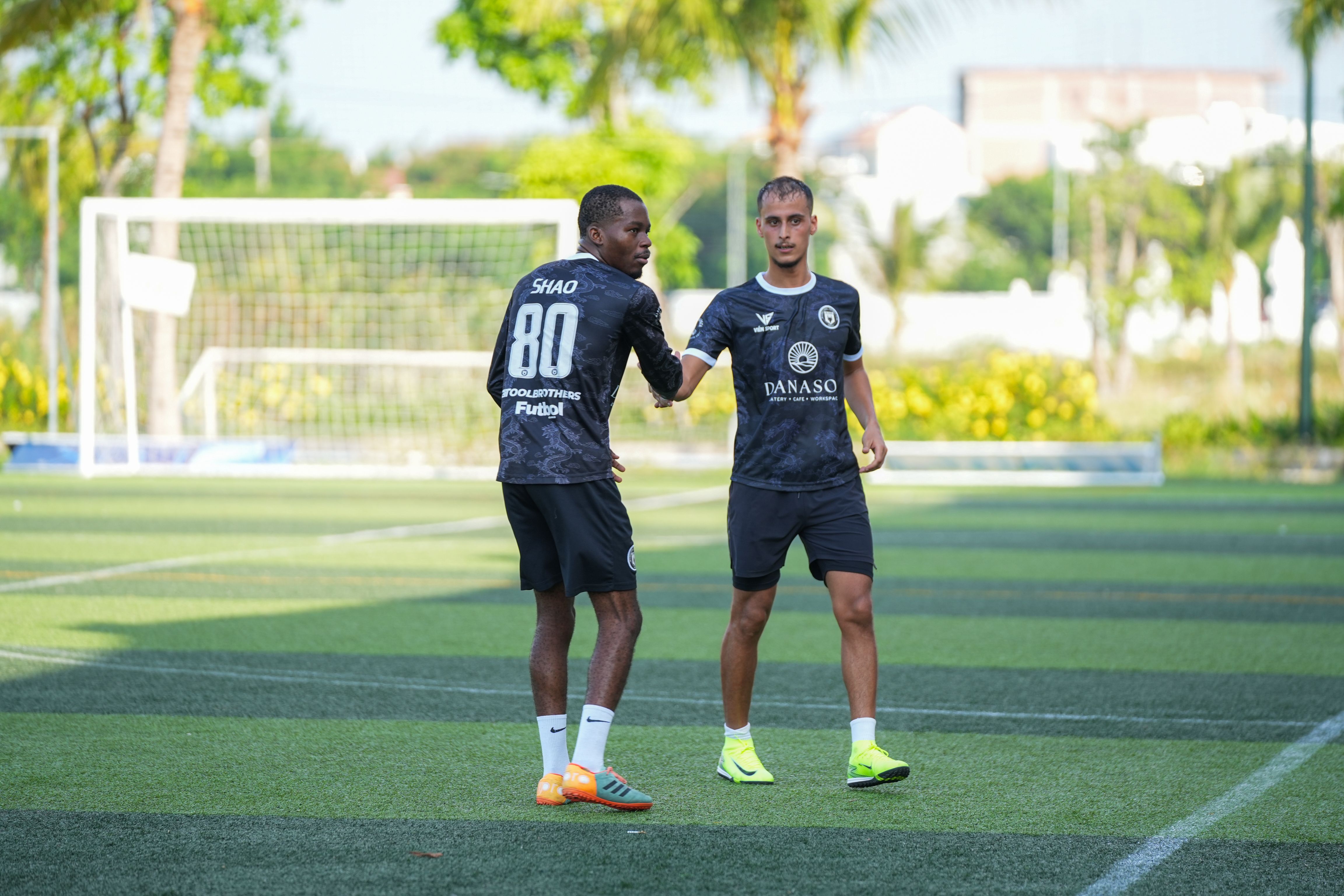 Soccer Players Shaking Hands on Outdoor Field · Free Stock Photo