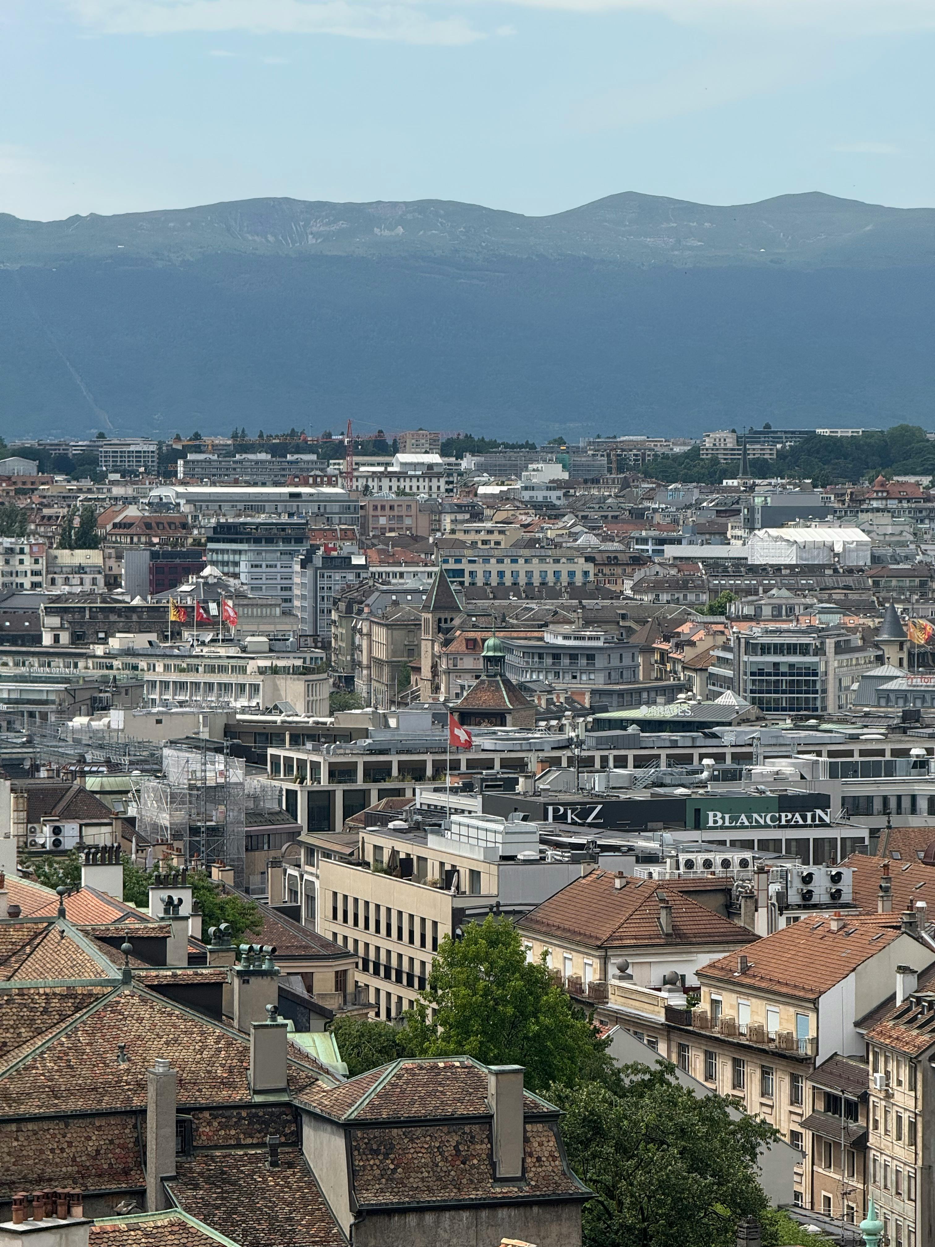 Scenic Cityscape of Geneva with Mountain Backdrop · Free Stock Photo