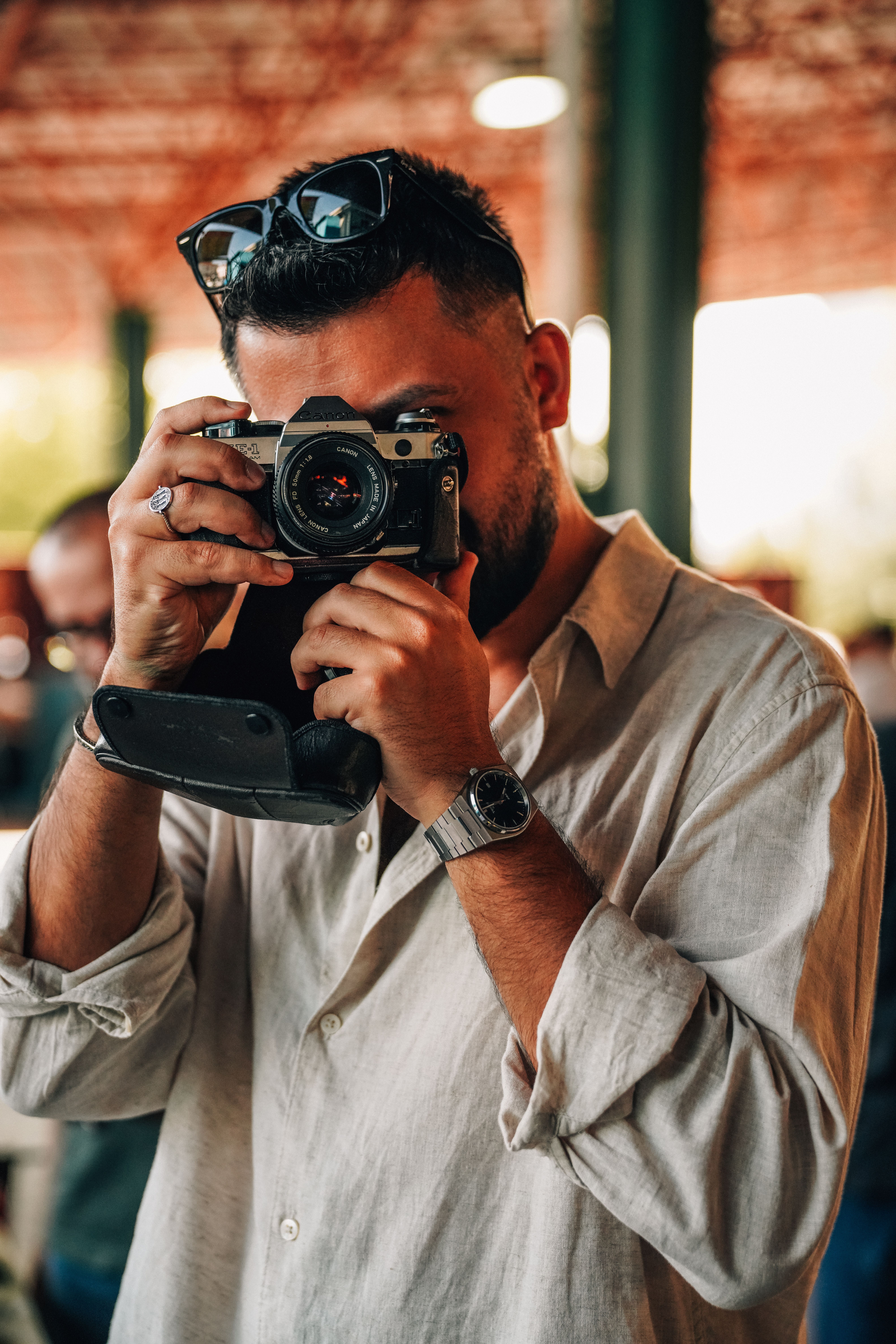 Man capturing moments with vintage camera · Free Stock Photo