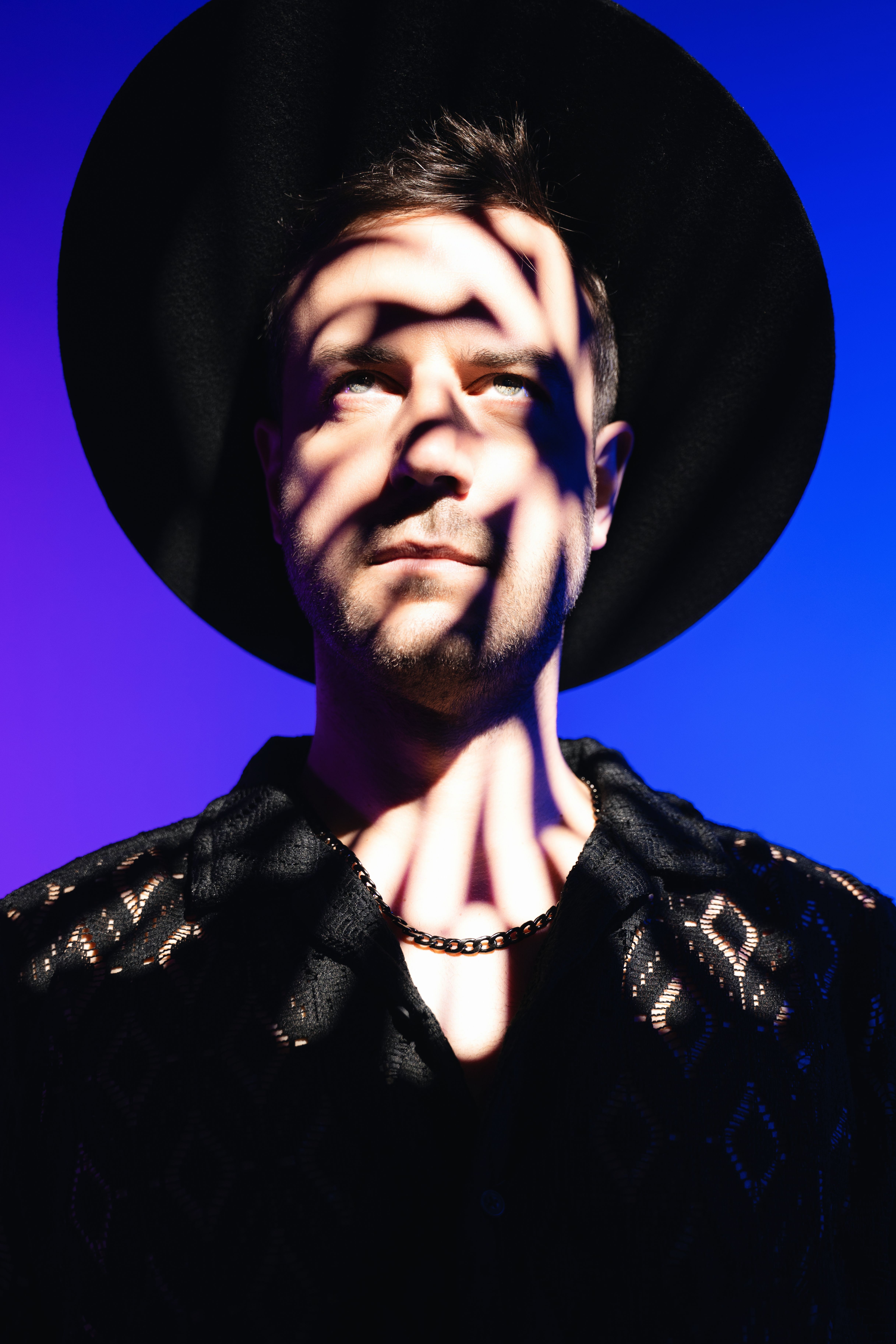 Artistic Portrait of Man in Dramatic Lighting · Free Stock Photo