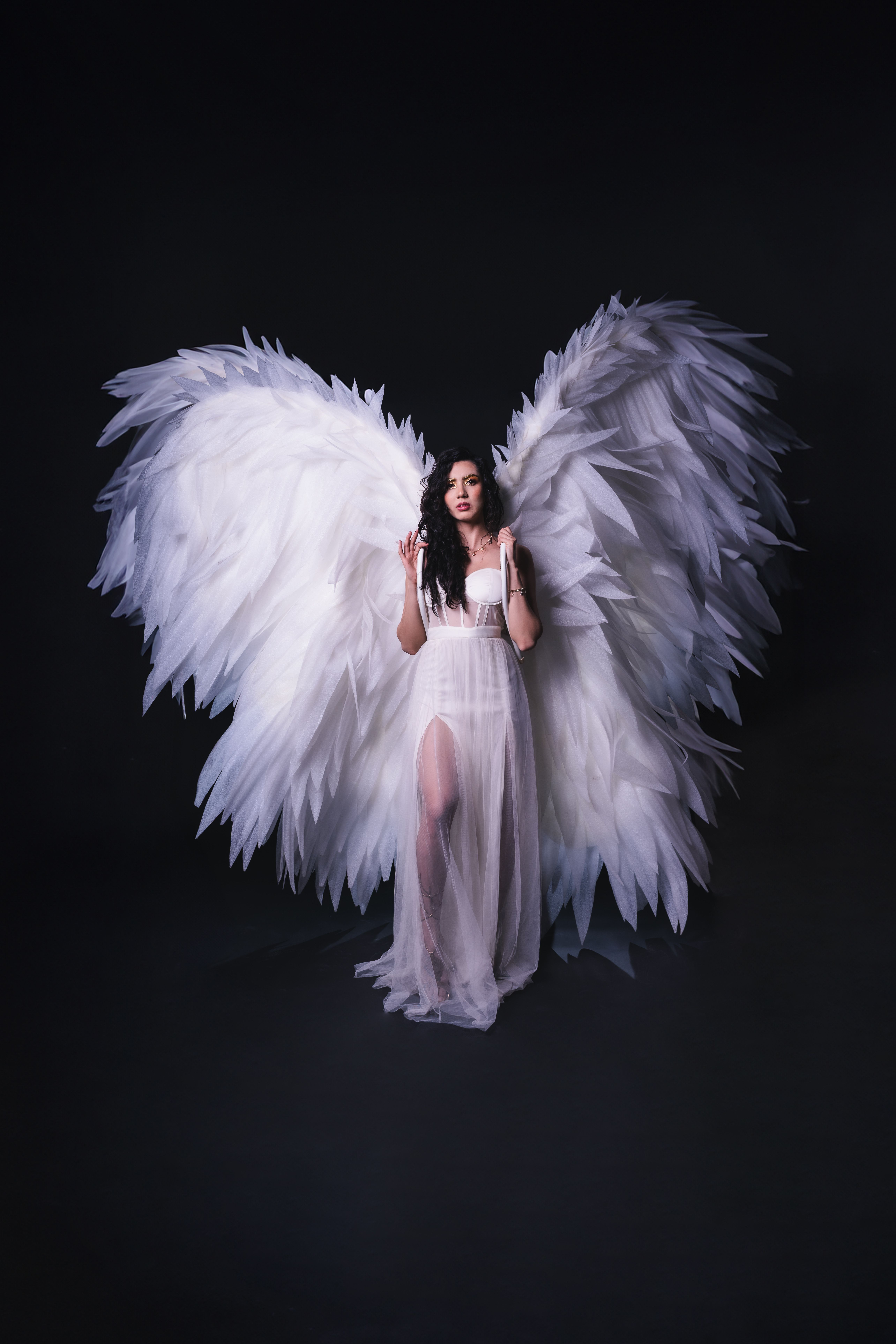Elegant Angel Costume with Large Feathered Wings · Free Stock Photo