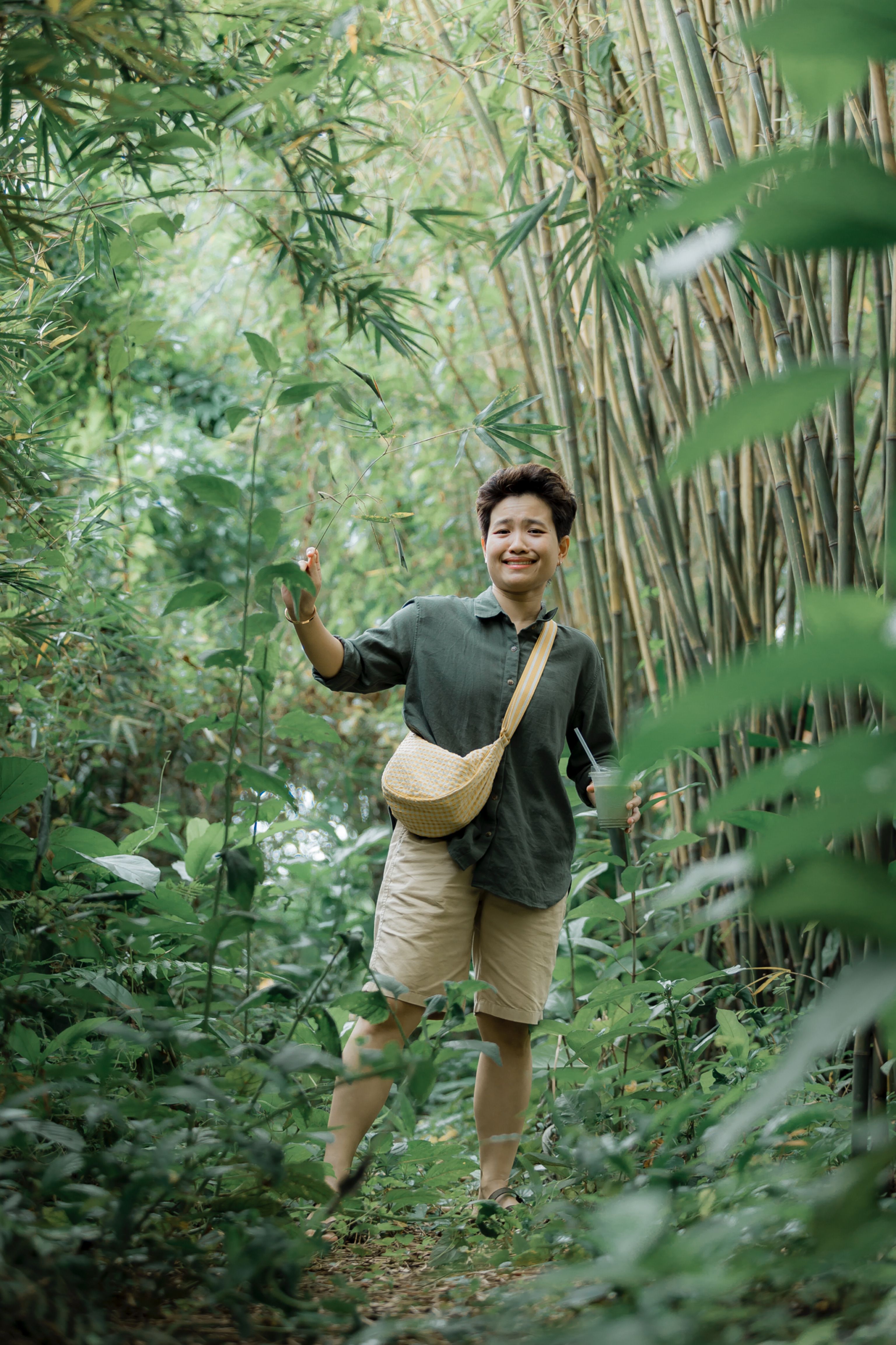 Young Person Exploring a Bamboo Forest Trail · Free Stock Photo