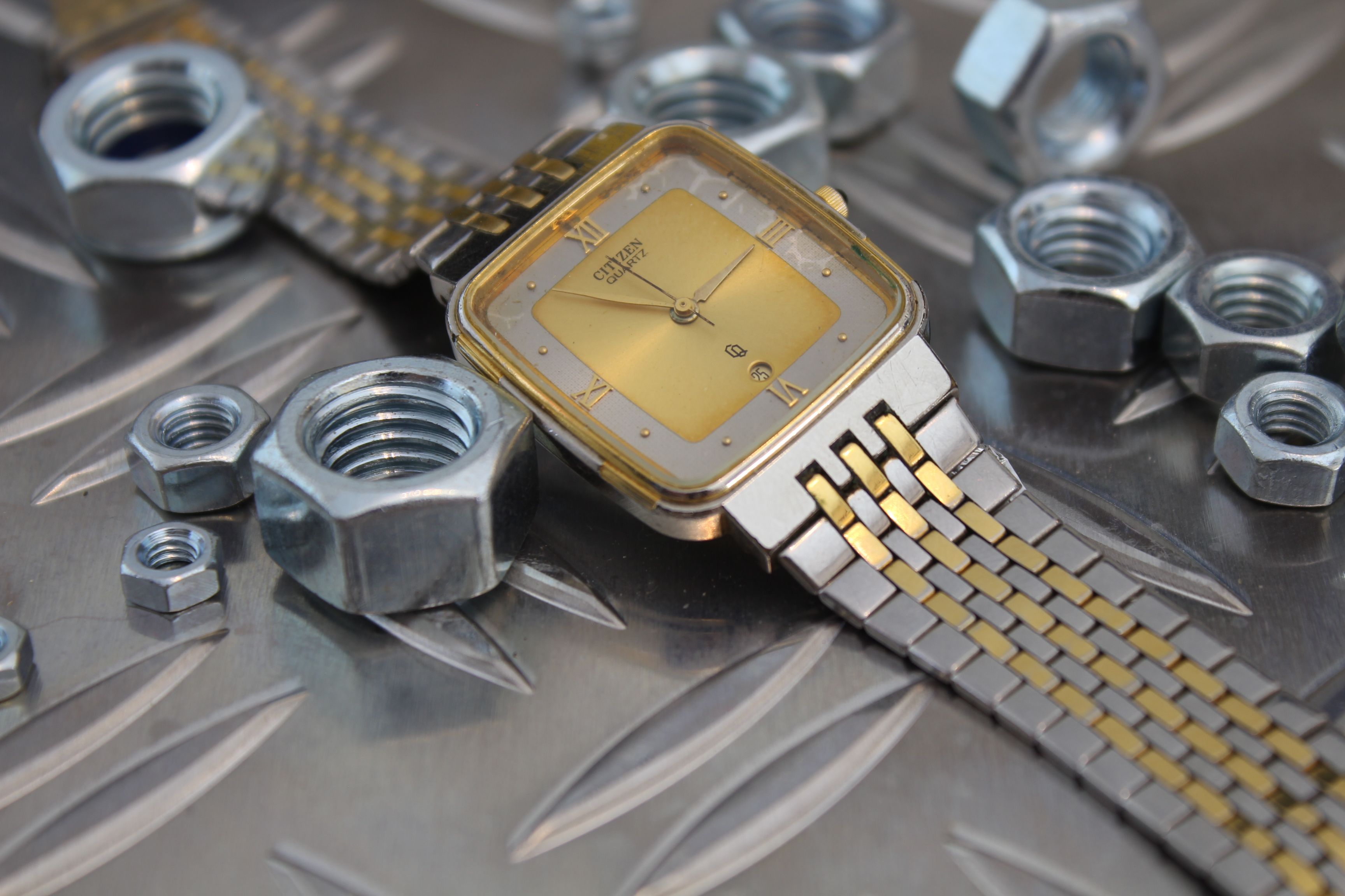 Elegant Wristwatch on Industrial Metal Surface · Free Stock Photo