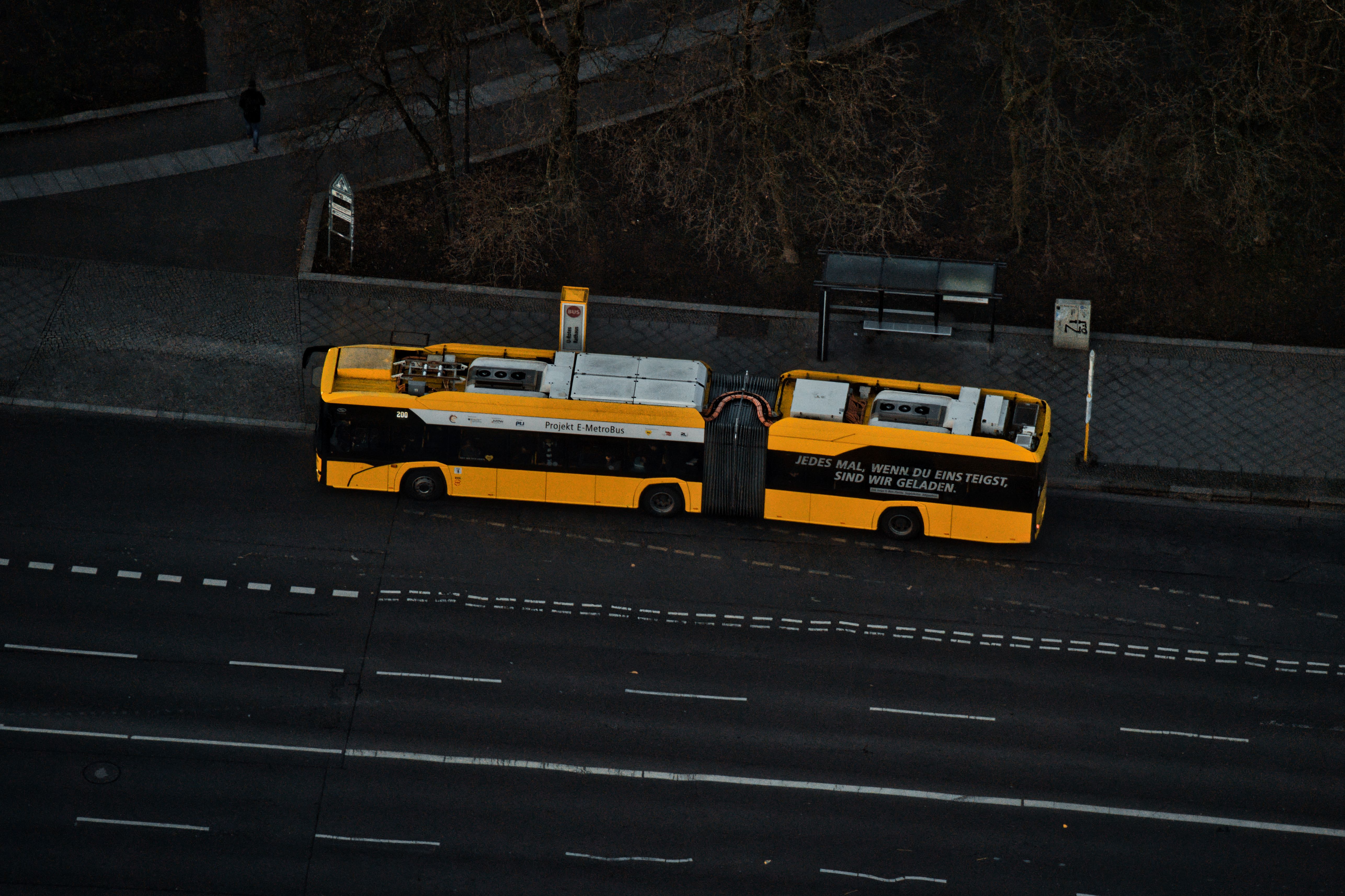 Aerial View of Yellow Bus on Berlin Street · Free Stock Photo