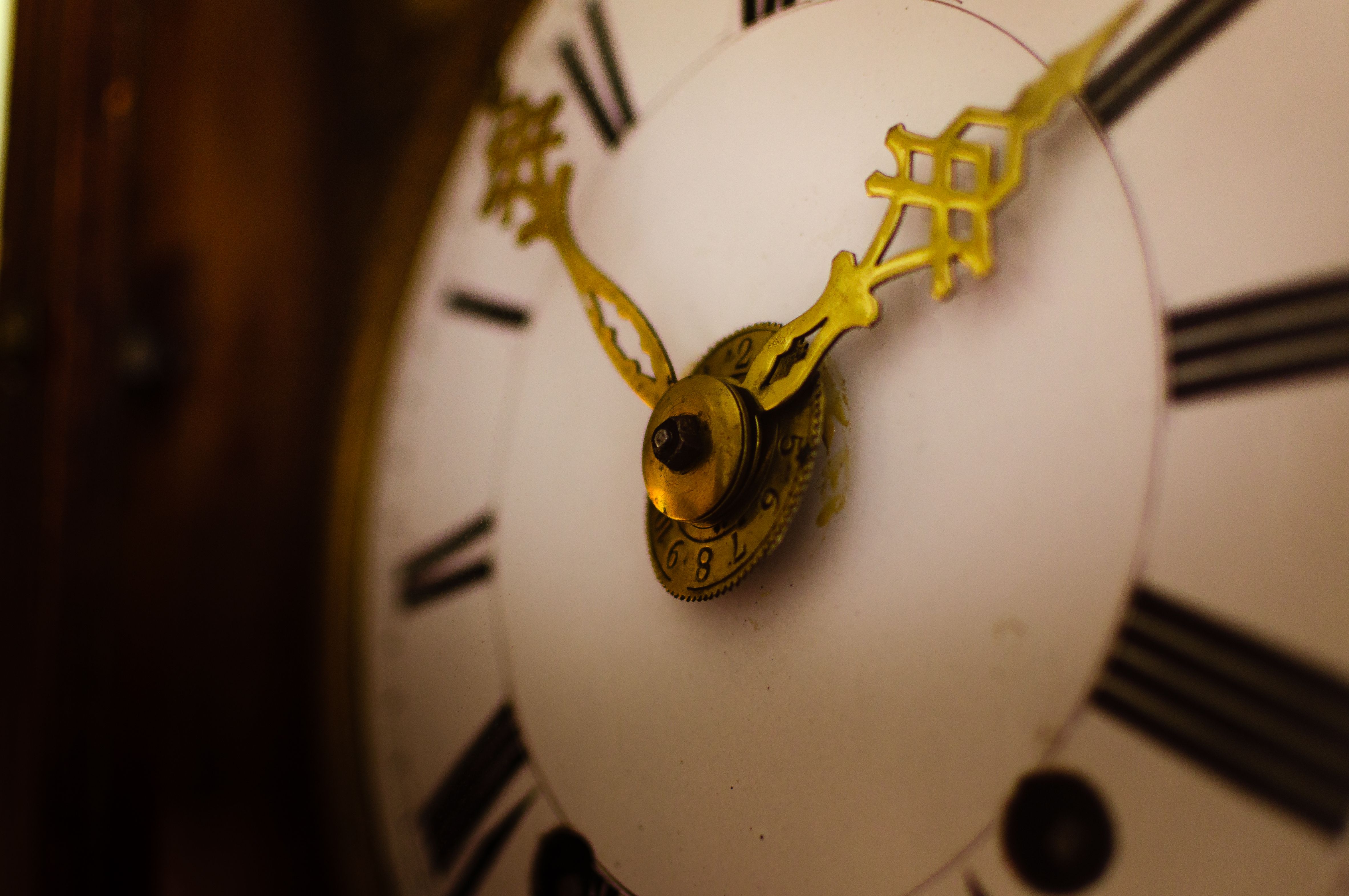 Close-Up of an Antique Clock Face with Roman Numerals · Free Stock Photo