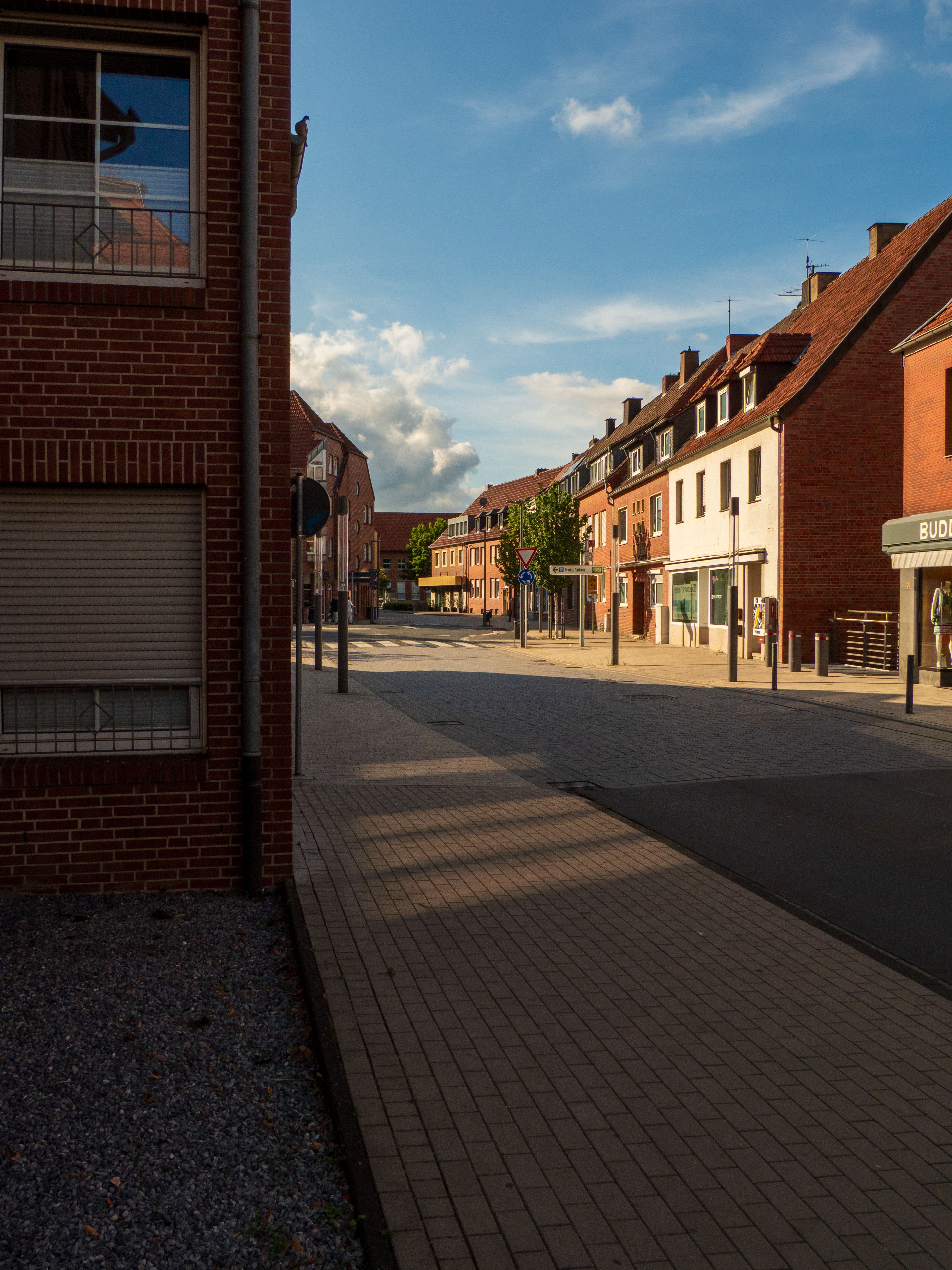 Quiet European Street with Brick Buildings · Free Stock Photo