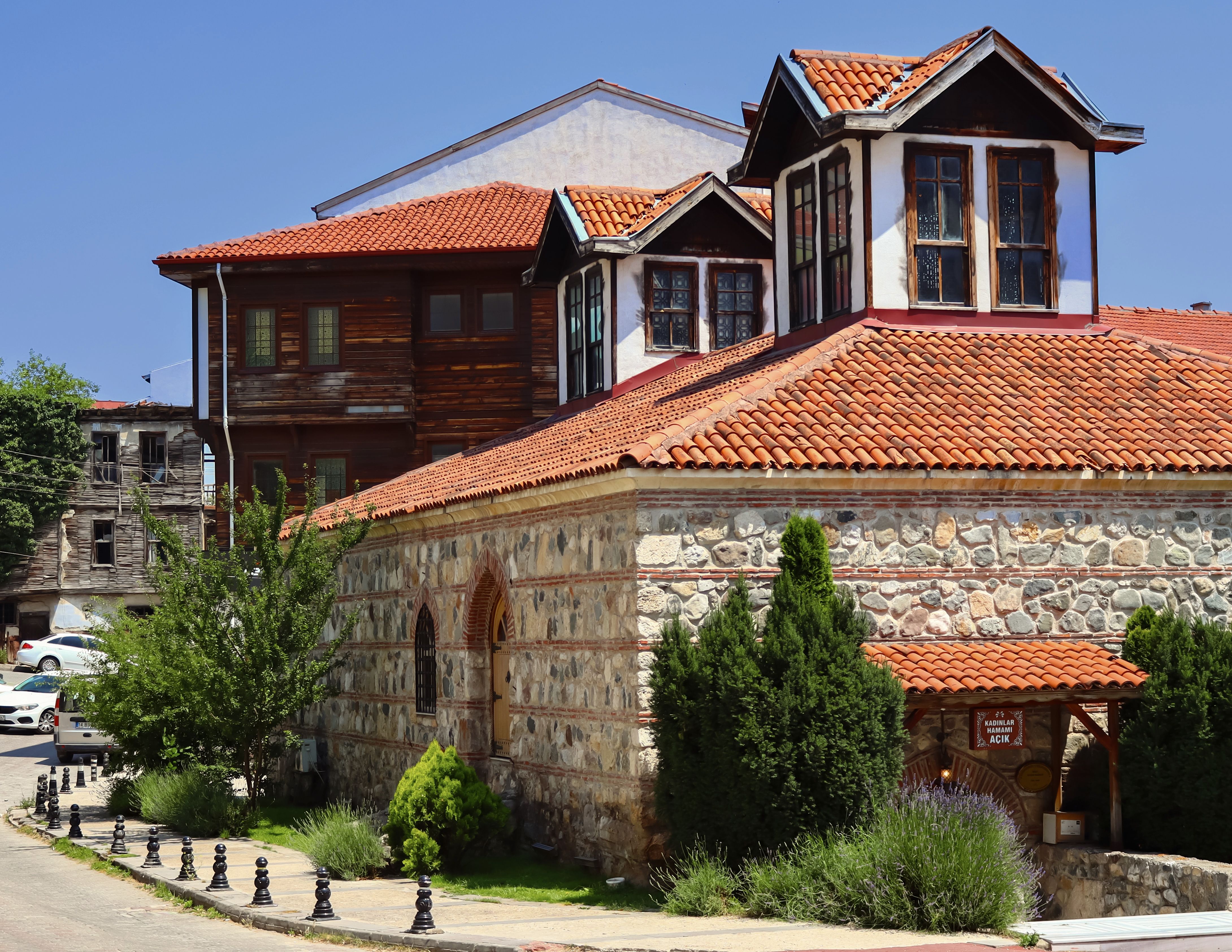 Historic Stone Building with Red Tiled Roof · Free Stock Photo