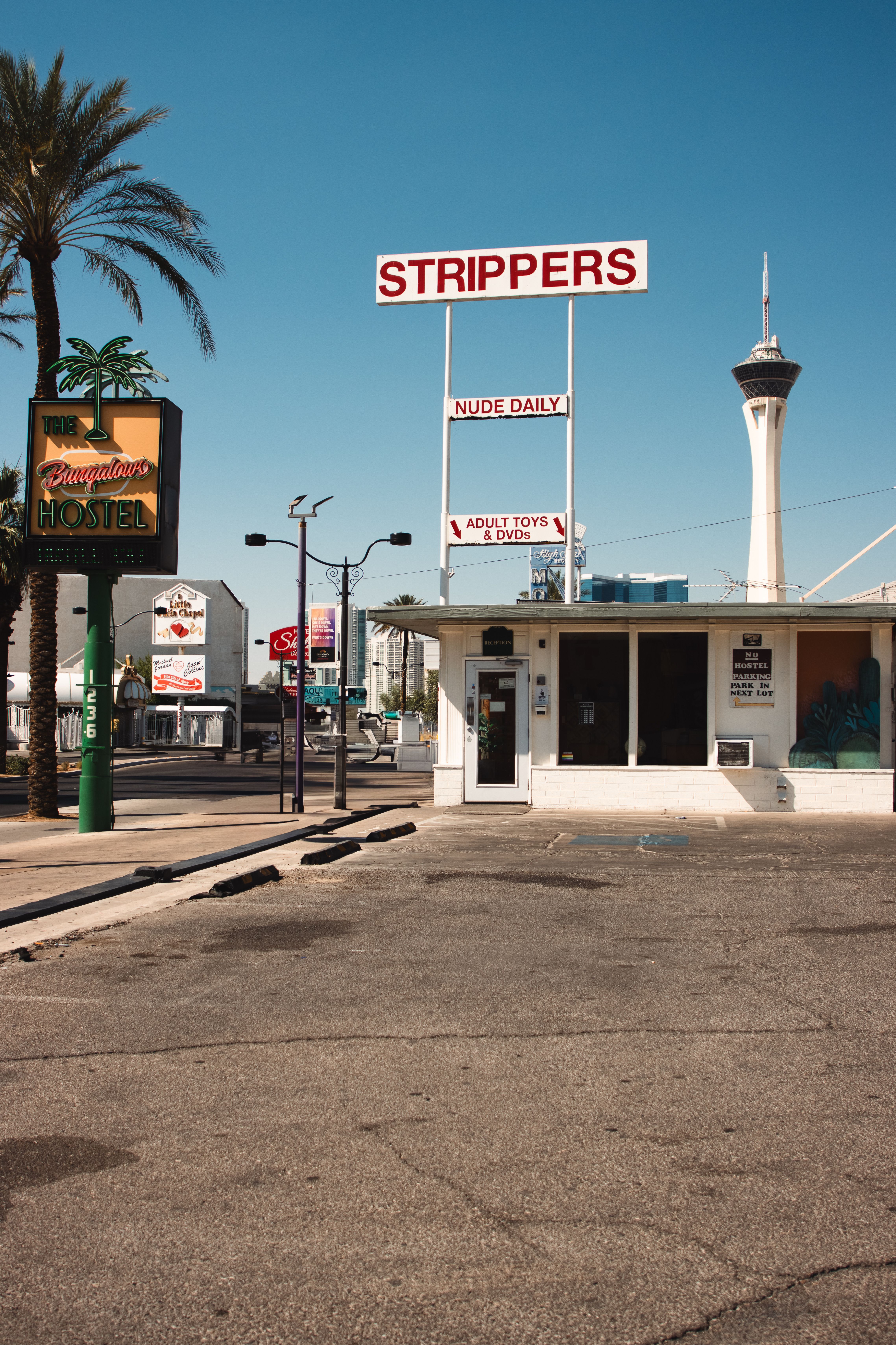 Strip Club Sign in Urban Las Vegas Setting · Free Stock Photo