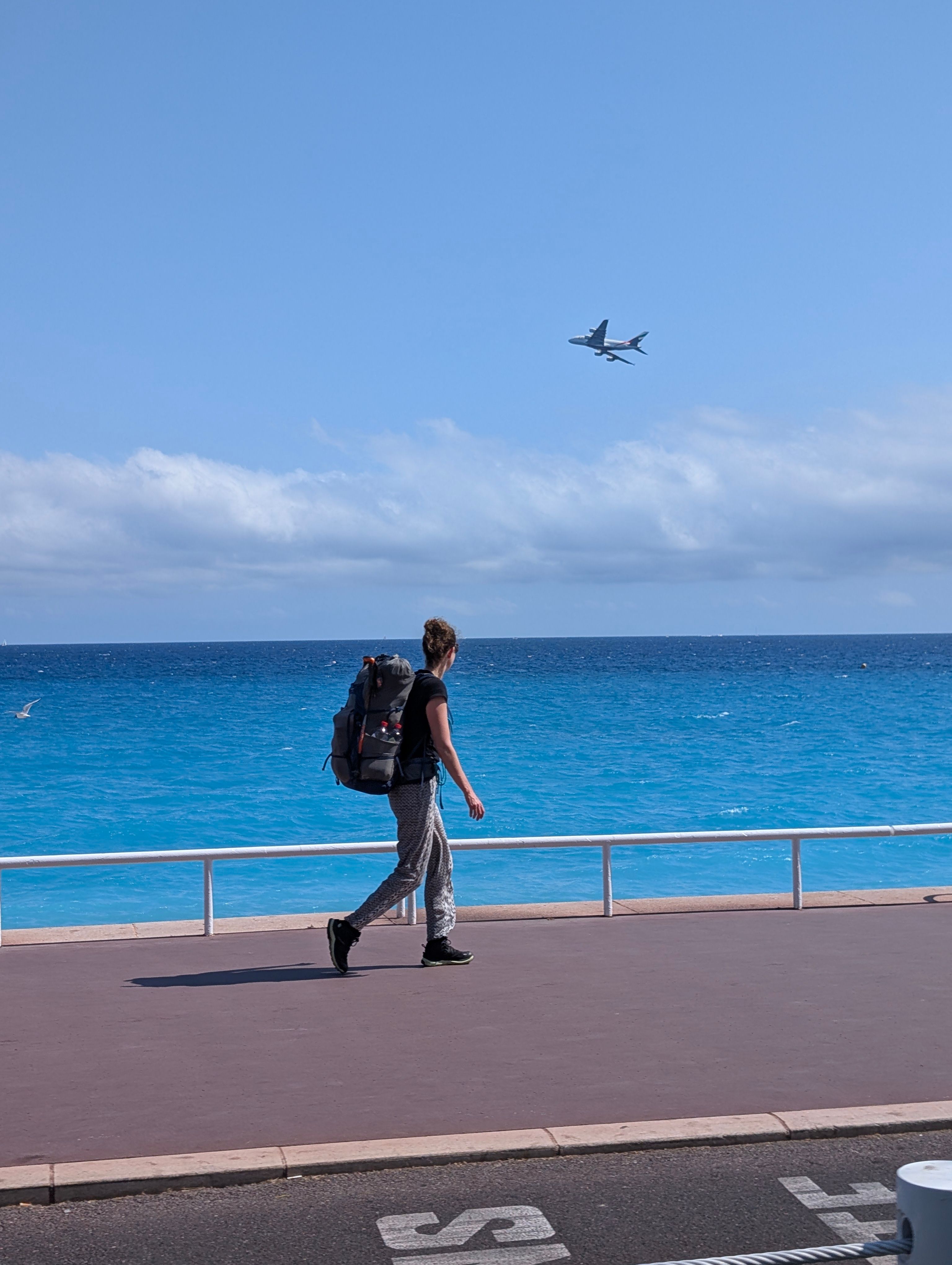 Traveler Walking Along Promenade in Nice, France · Free Stock Photo