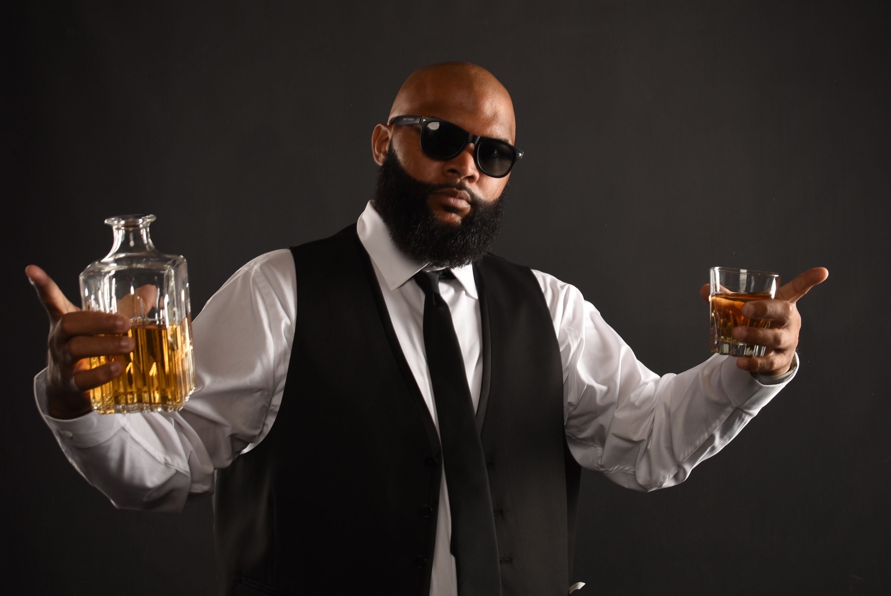Stylish Man With Whiskey in Classic Suit · Free Stock Photo
